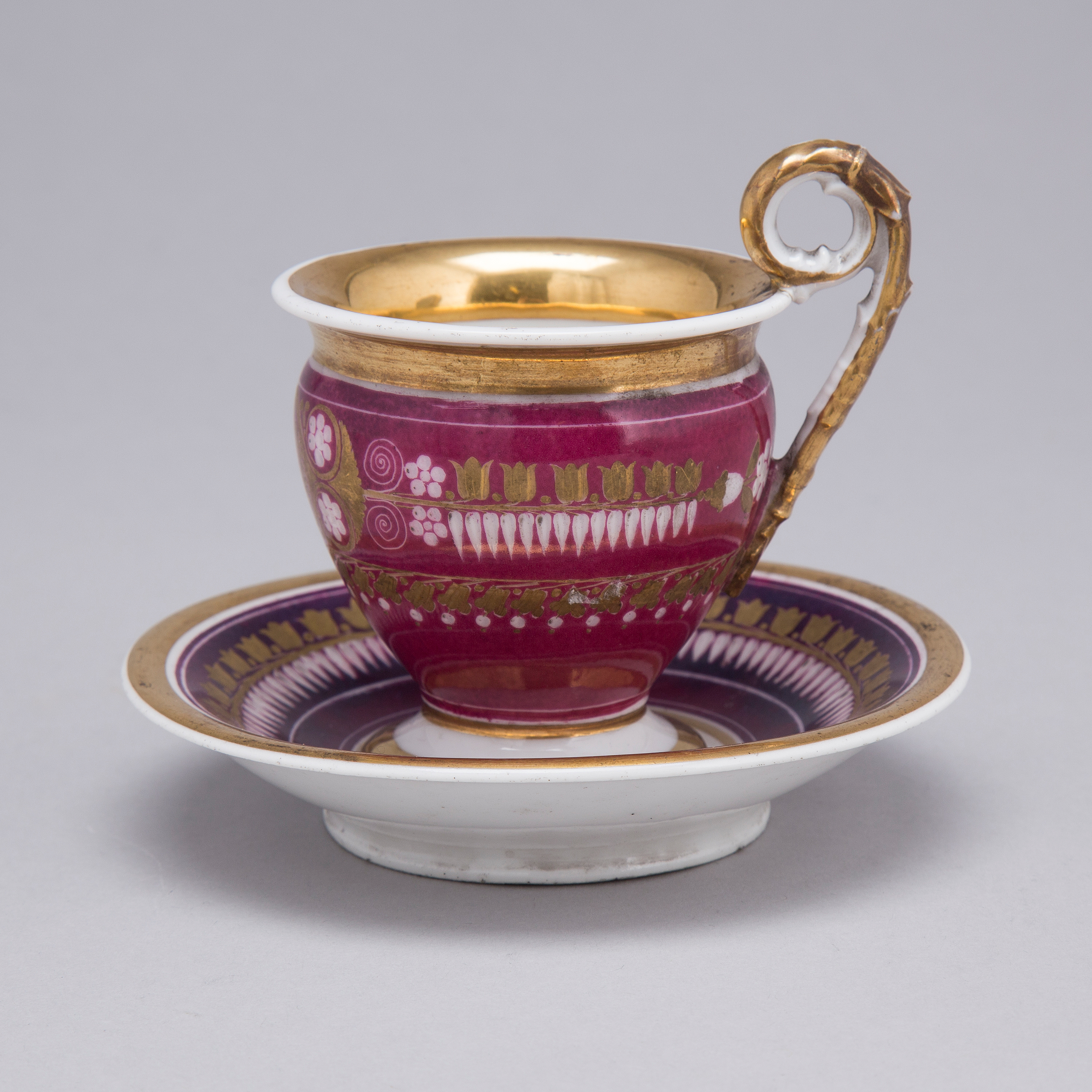 AN EMPIRE PORCELAIN CUP AND SAUCER, first half of the 19th century ...
