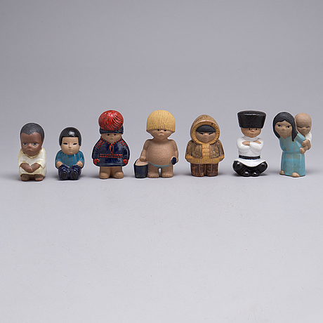 A collection of seven stonewear figurines from the series "All världens barn" by Lisa Larson for ...