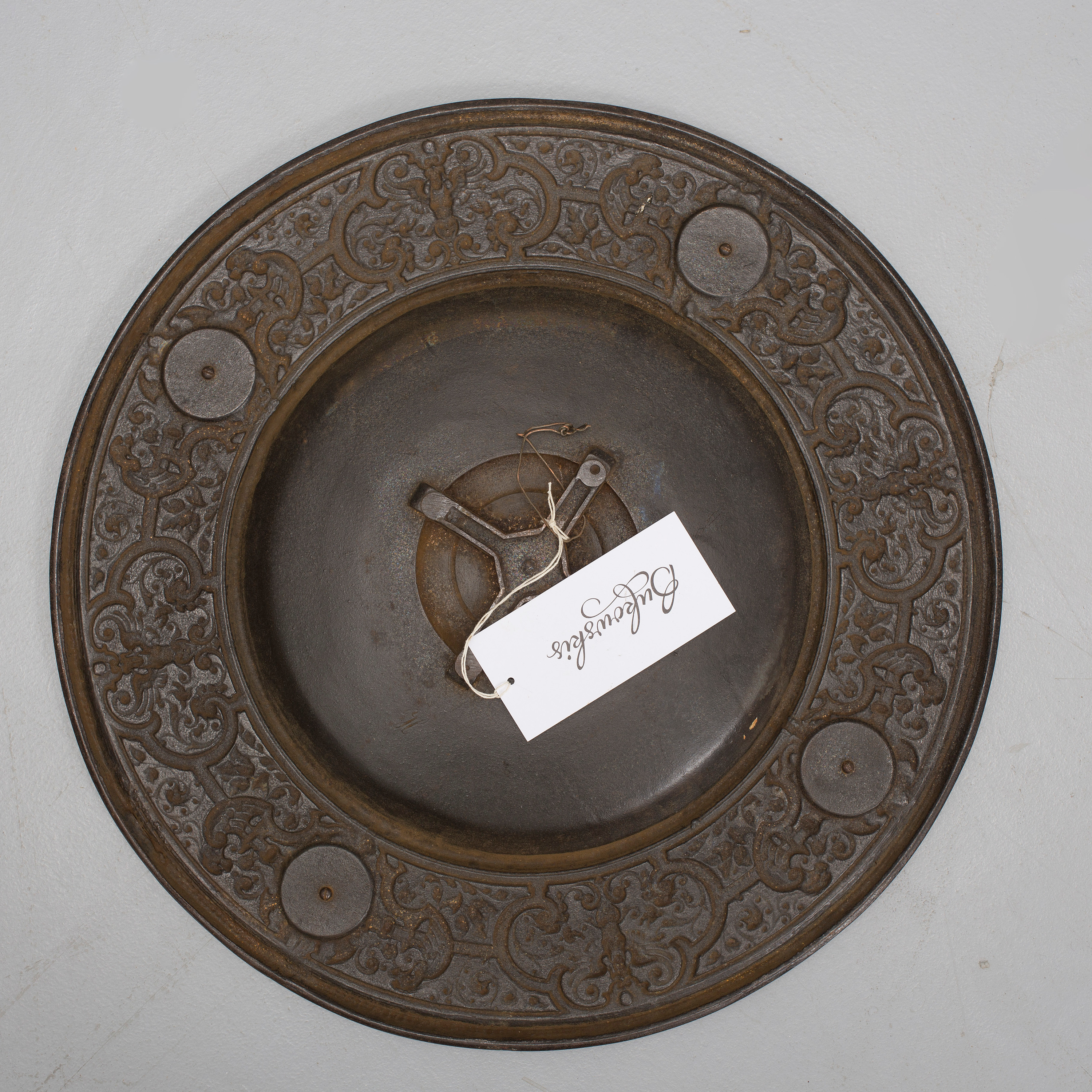 A PAIR OF IRON AND BRONZE WALL PLAQUES, first half of the 19th century ...