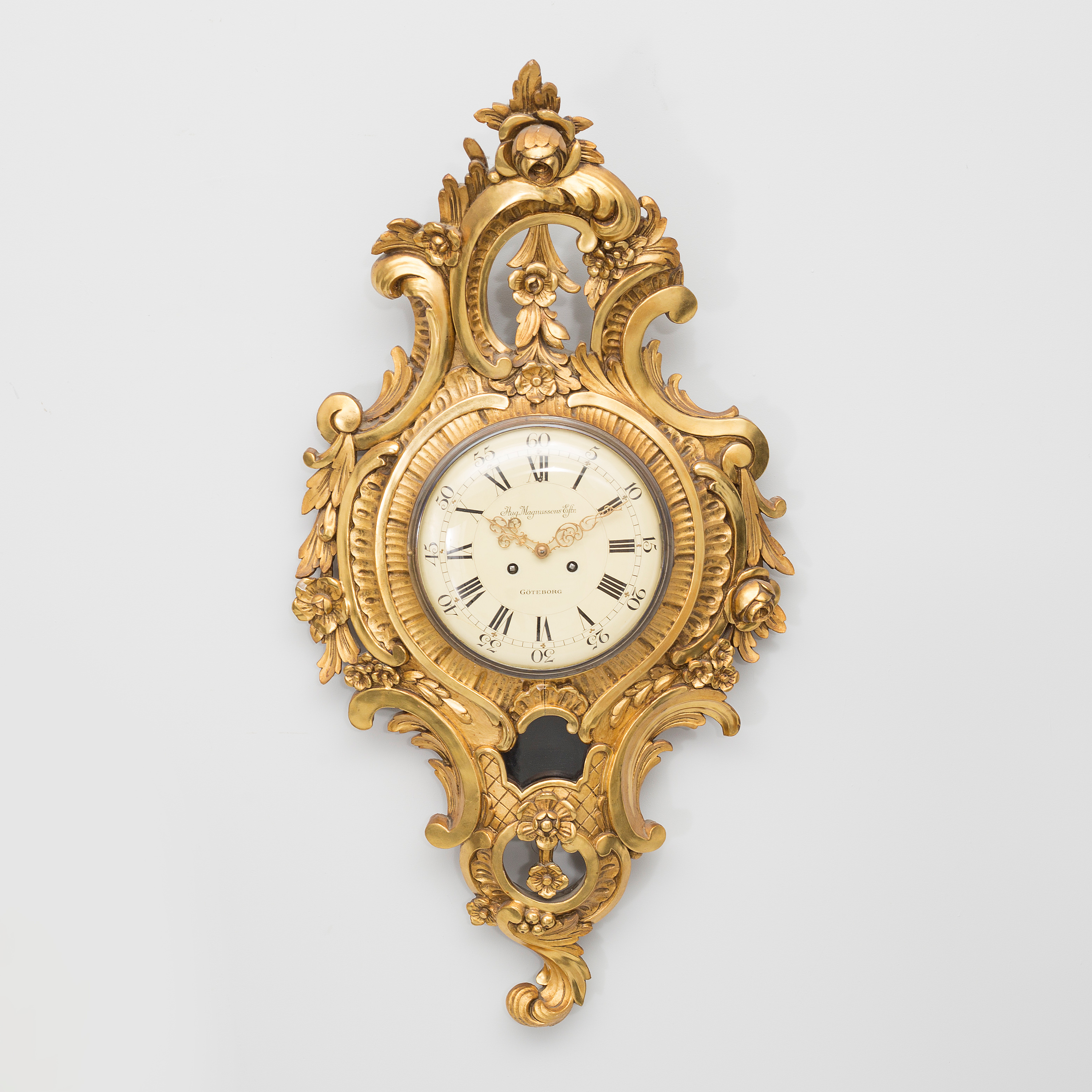 A rococo style wall clock, first half of the 20th century. - Bukowskis