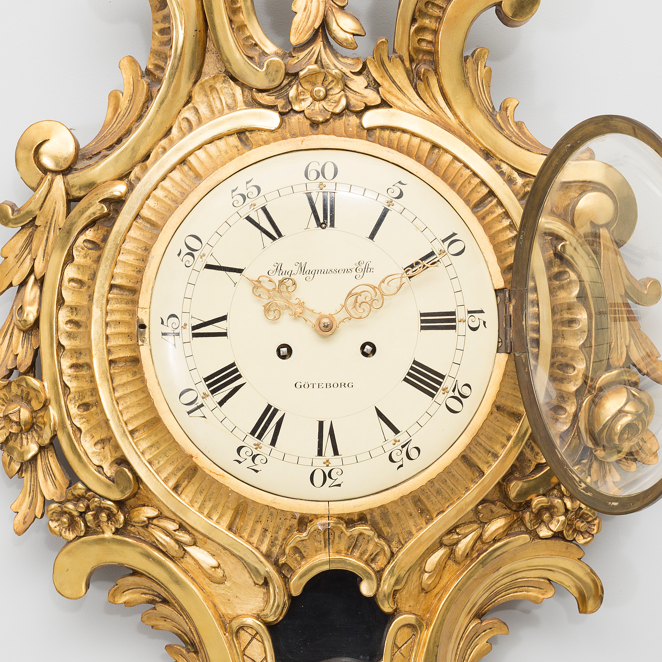 A rococo style wall clock, first half of the 20th century. - Bukowskis