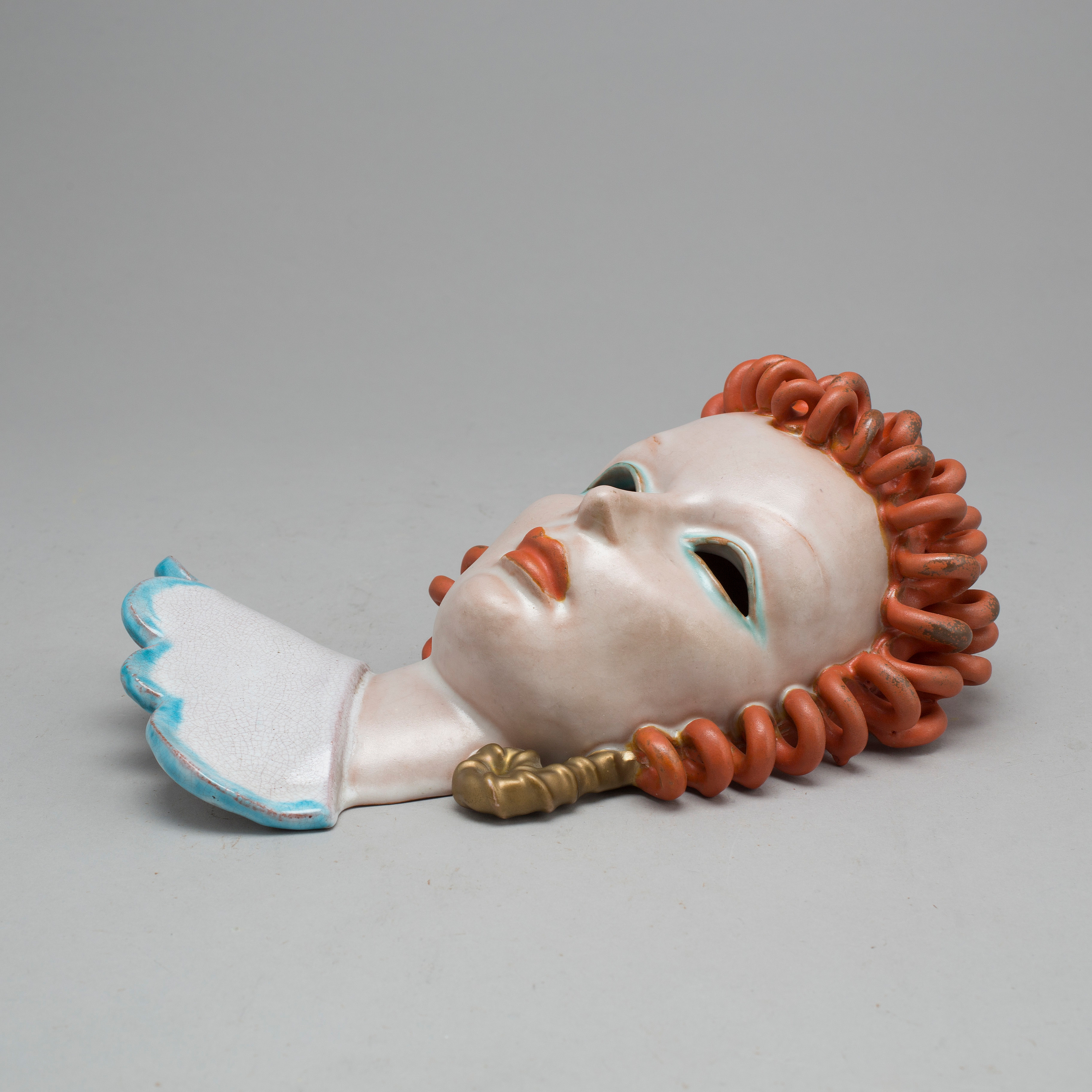 A glazed terracotta mask by Goldscheider, Austria, 20th century ...