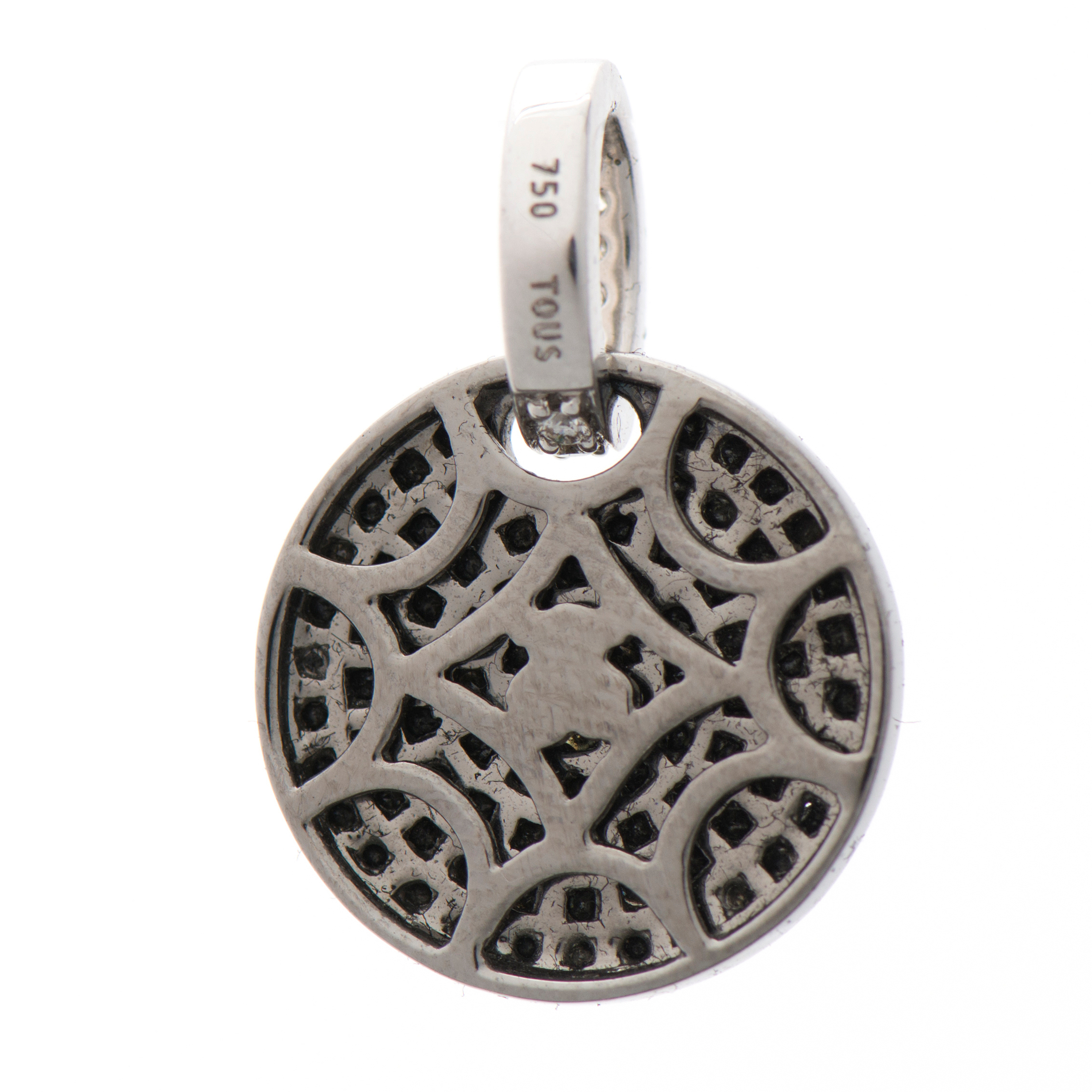 A PENDANT, brilliant cut black and colorless diamonds, 18K white gold ...