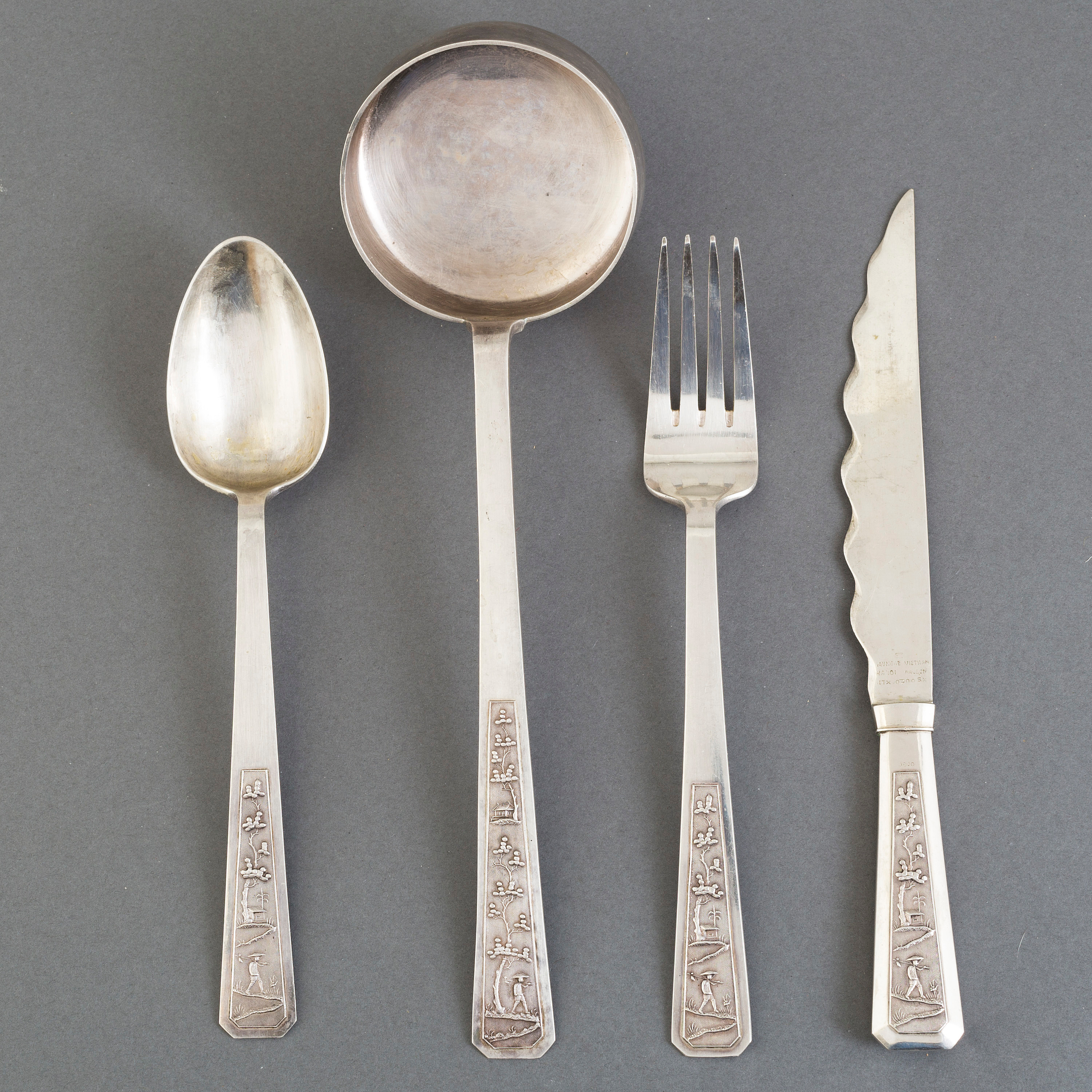 A part silver cutlery, Vietnam, Hanoi, 20th century, total weight 2986 ...