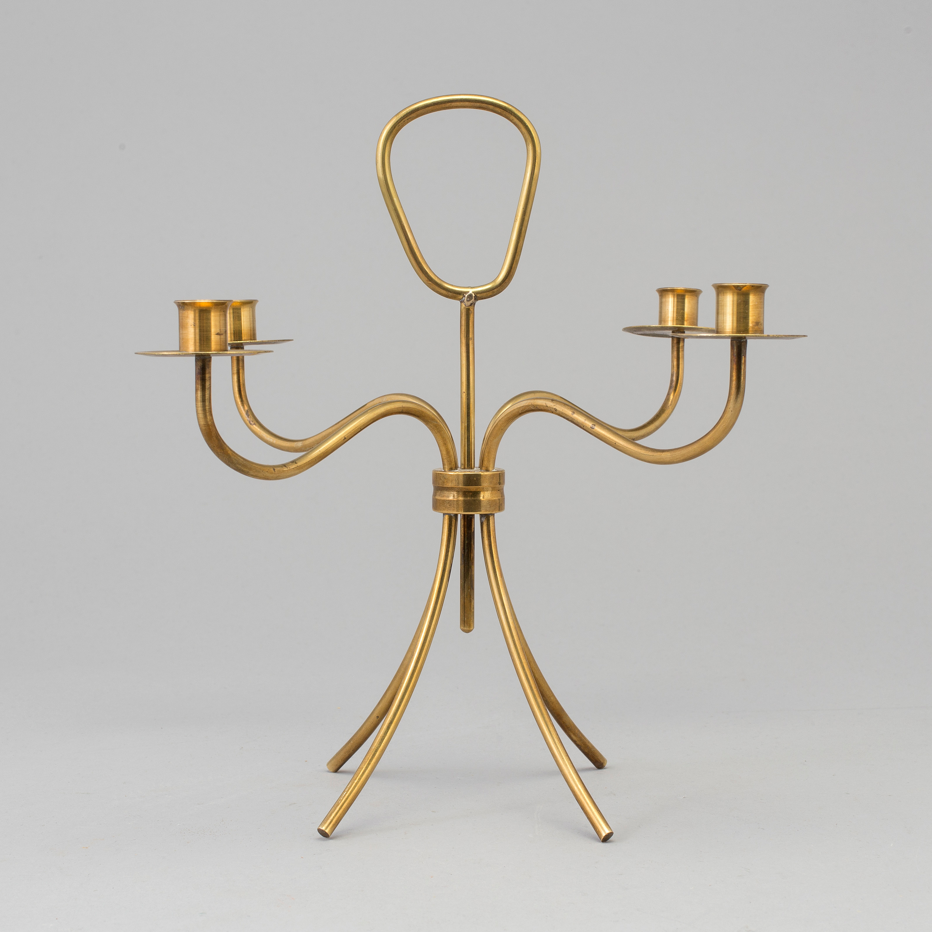 A brass candelabrum, mid 20th Century. - Bukowskis