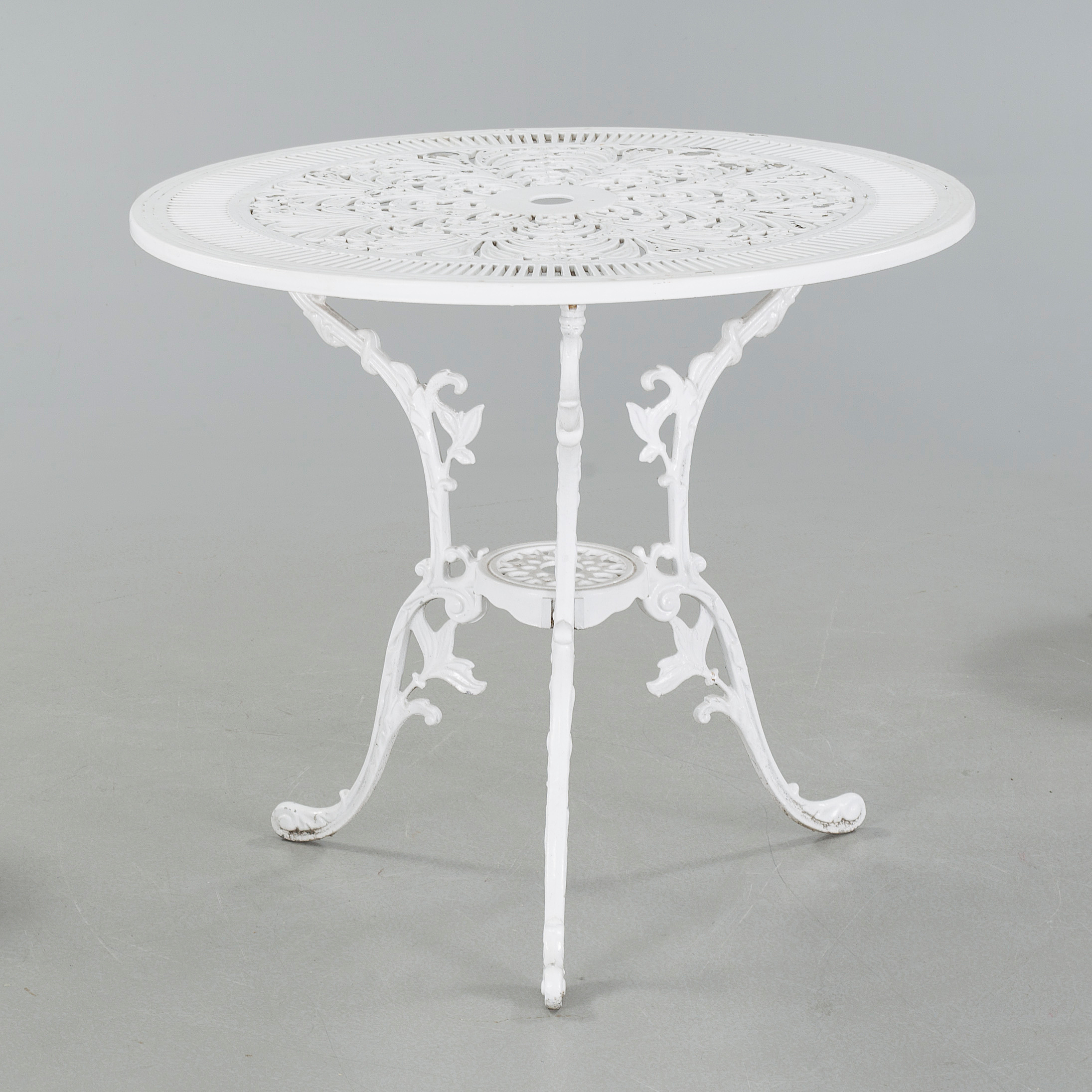 A garden table and four chairs from the latter half of the 20th century ...