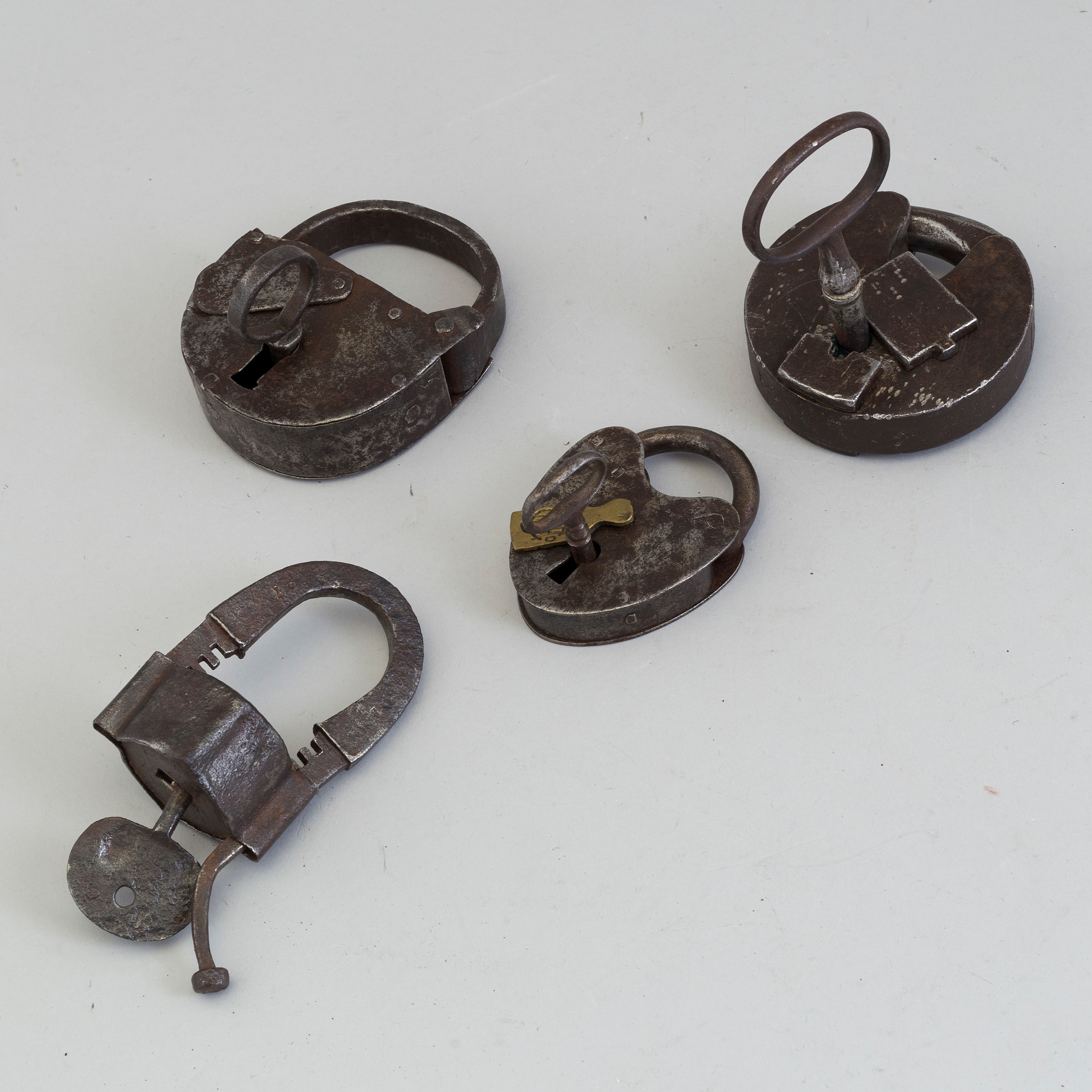 FOUR CAST IRON HANGING LOCKS, 118th/19th century. - Bukowskis