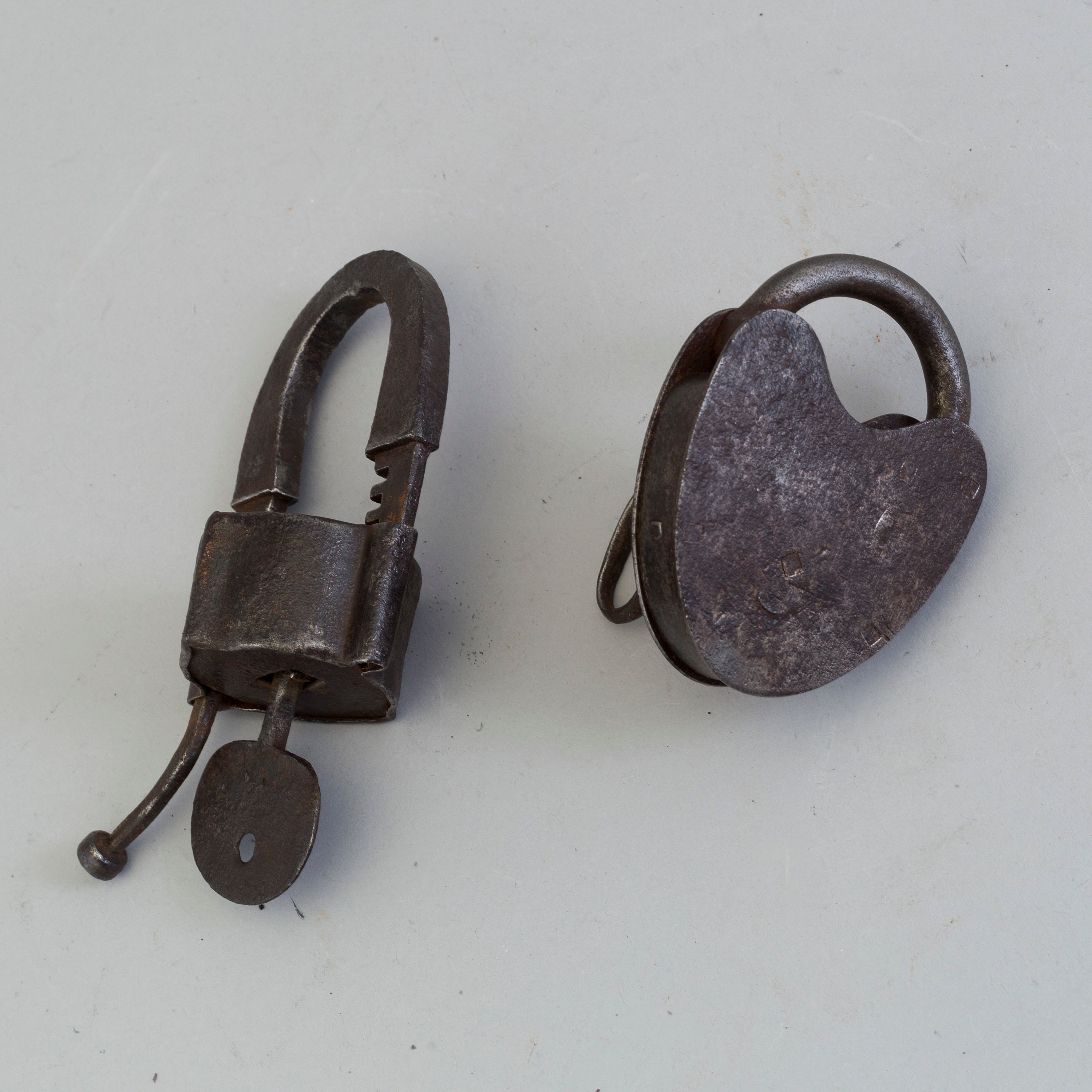 FOUR CAST IRON HANGING LOCKS, 118th/19th century. - Bukowskis
