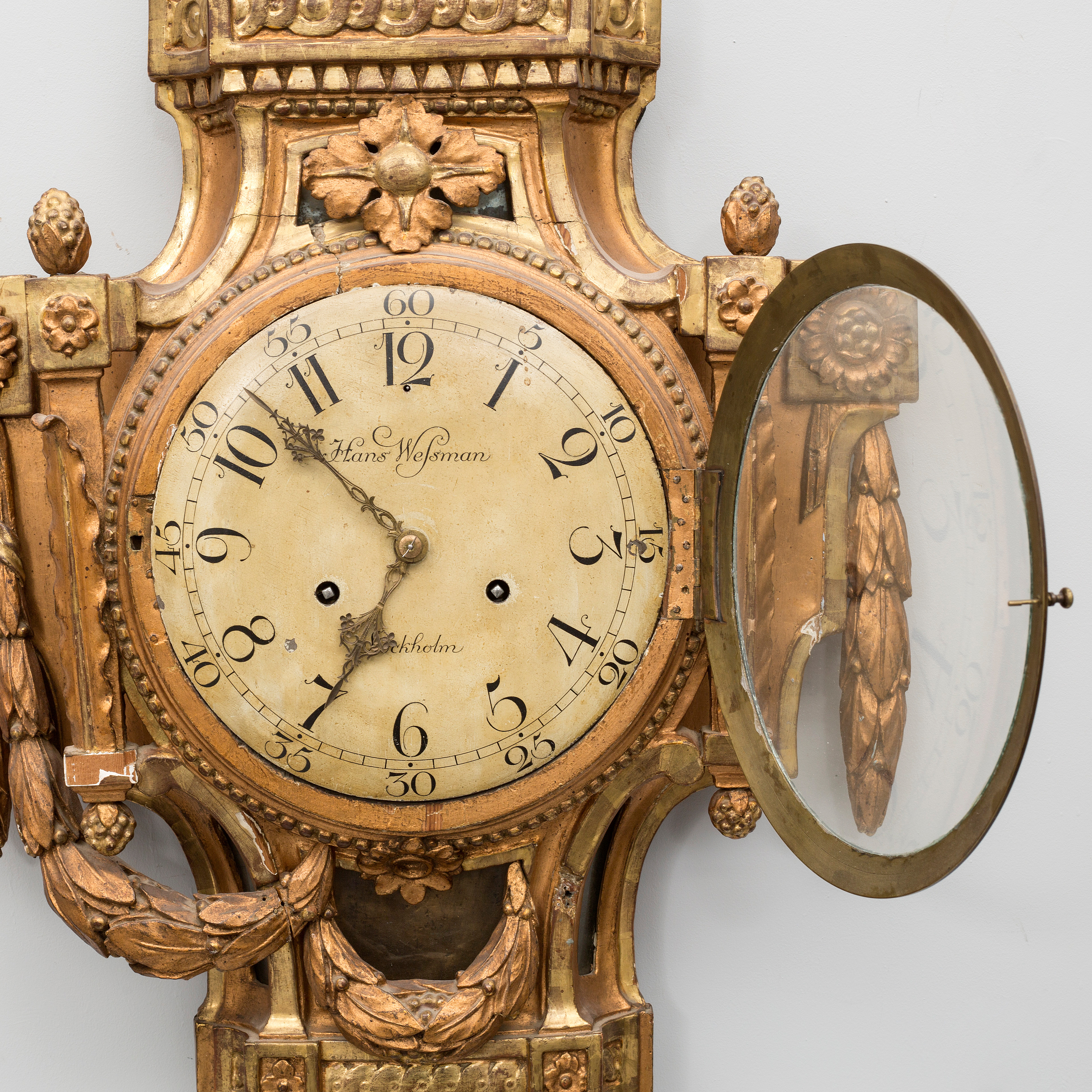 A gustavian wall clock, dial marked "Hans Wessman, Stockholm", around ...