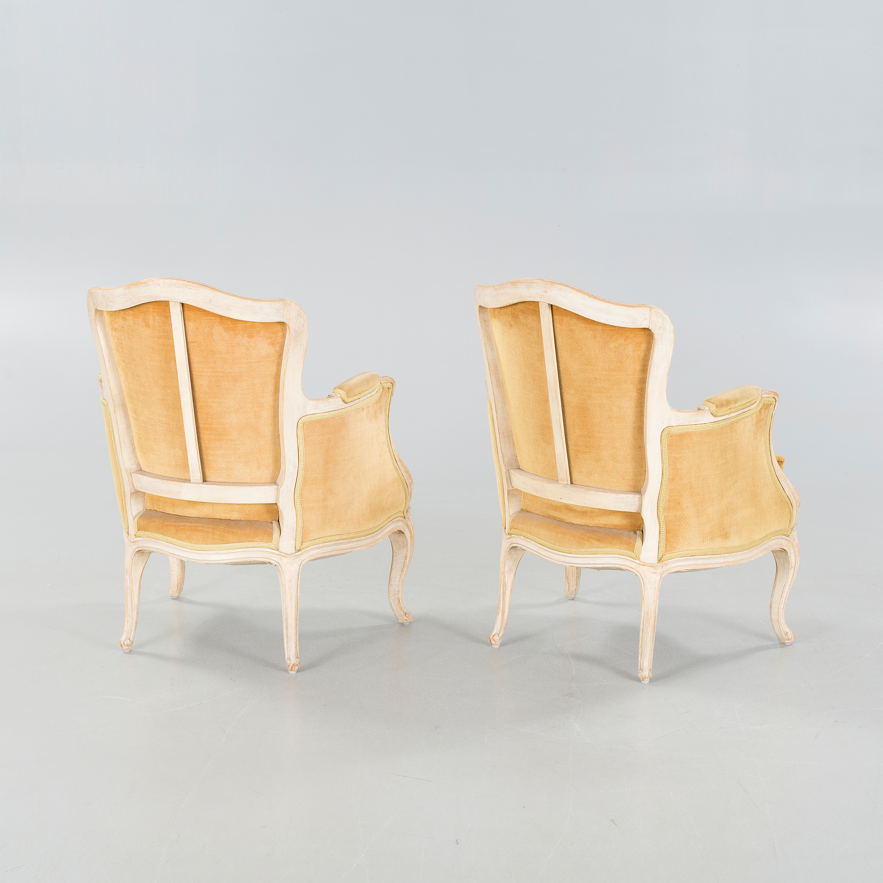 A pair of rococo style lounge chairs, first half of the 20th century ...