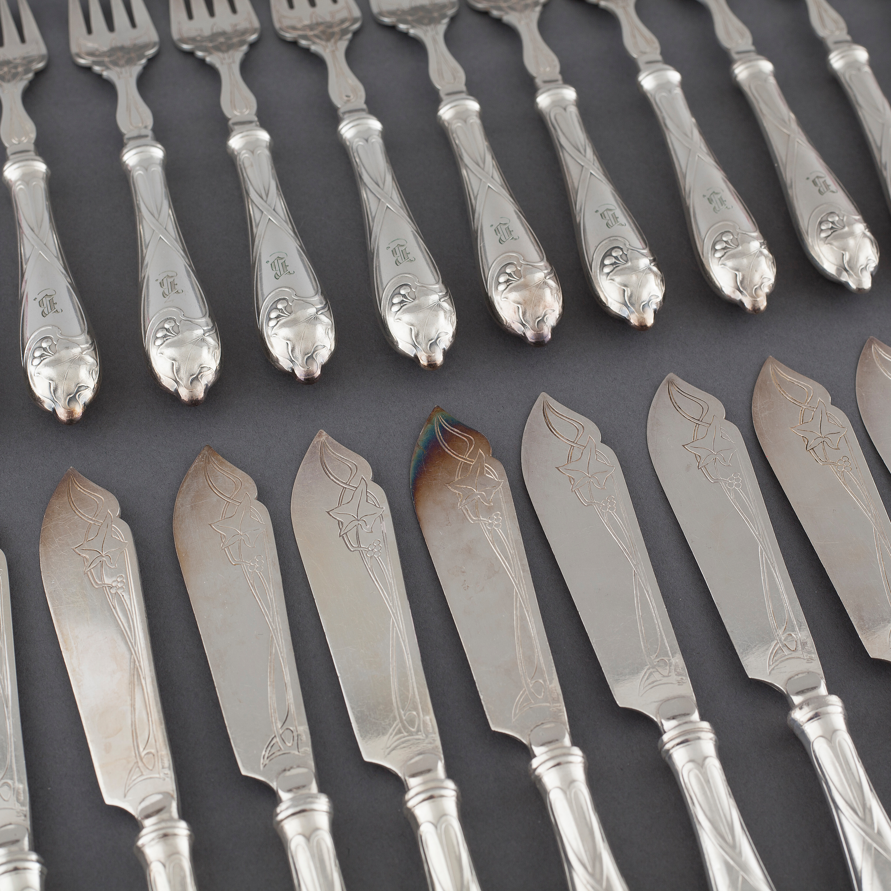 An early 20th century set of 26 pcs of silver plated fish flatware by ...
