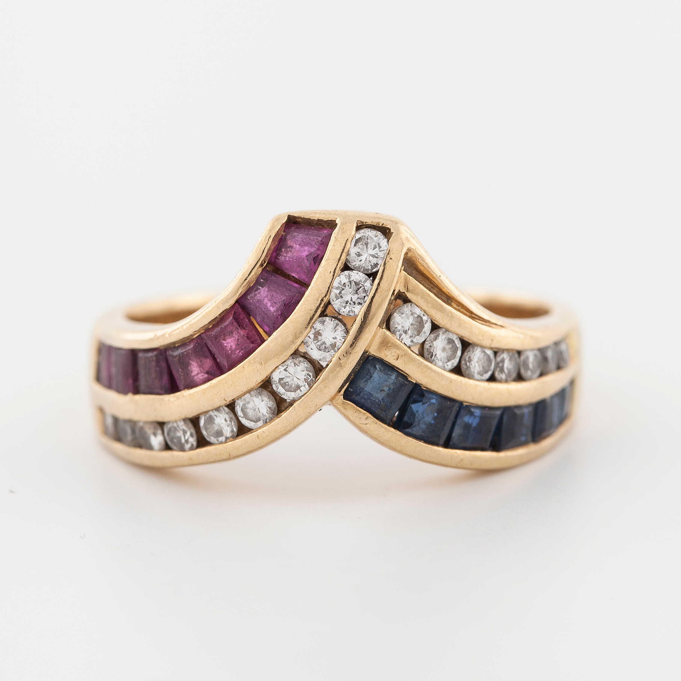 A faceted ruby and sapphire, and brilliant cut diamond ring. - Bukowskis