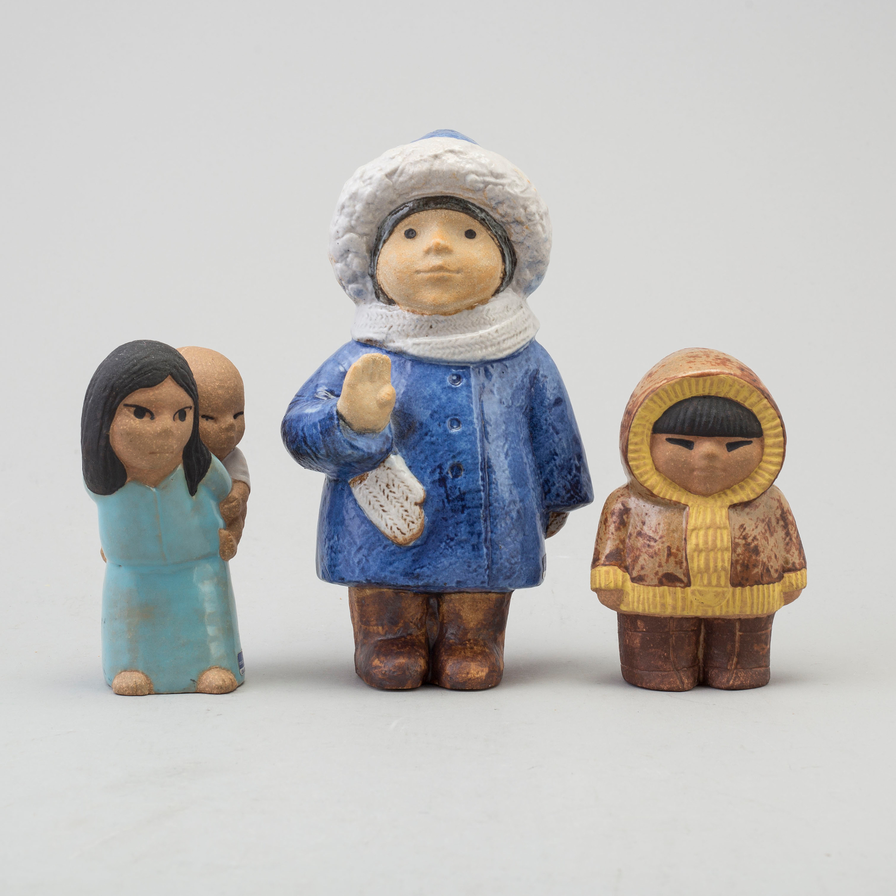 LISA LARSON, a set of three stoneware figurines, "North" and "East", 1974 and "Four years", 1977 ...