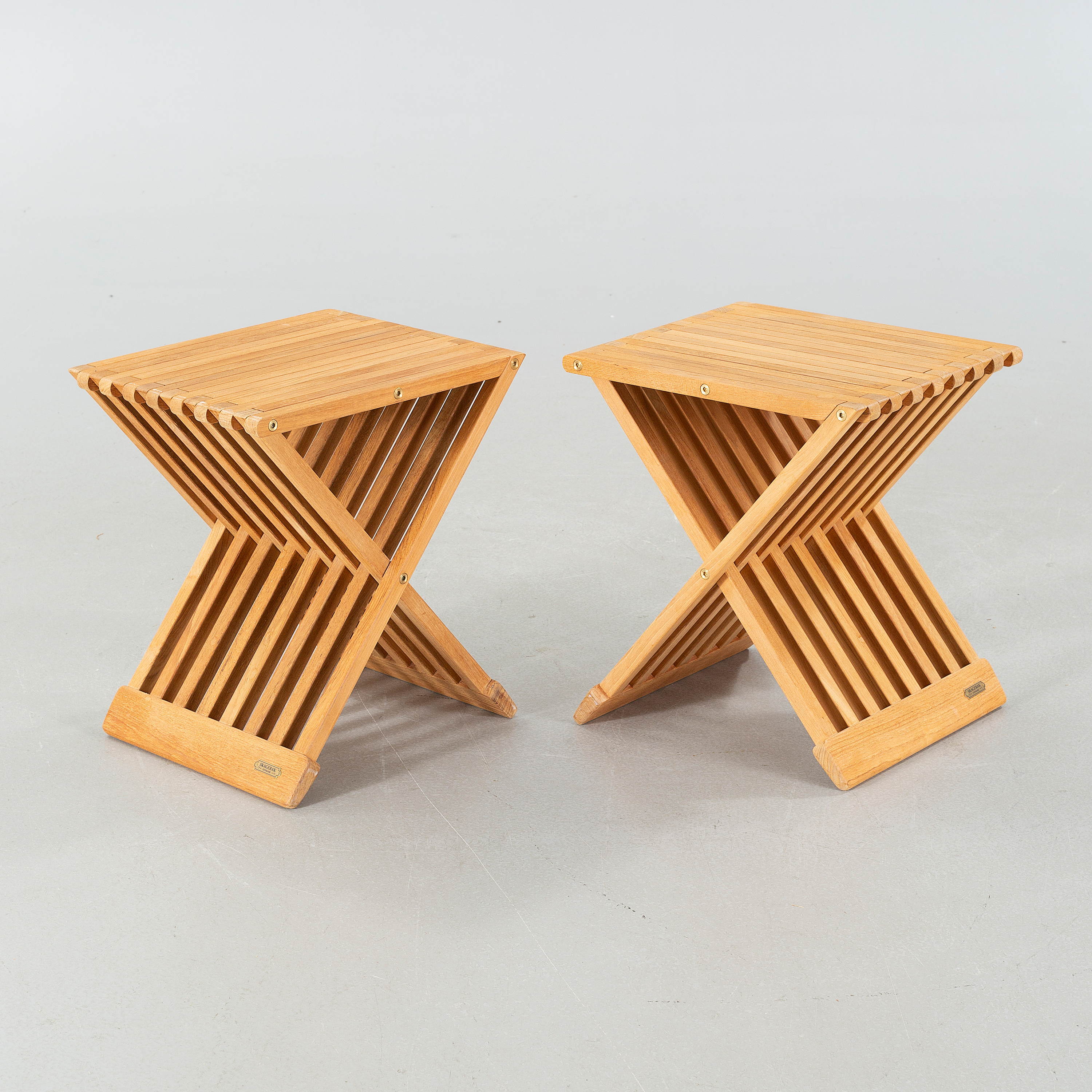 A pair of 21st century stool designed by Jens H. Quistgaard for ...