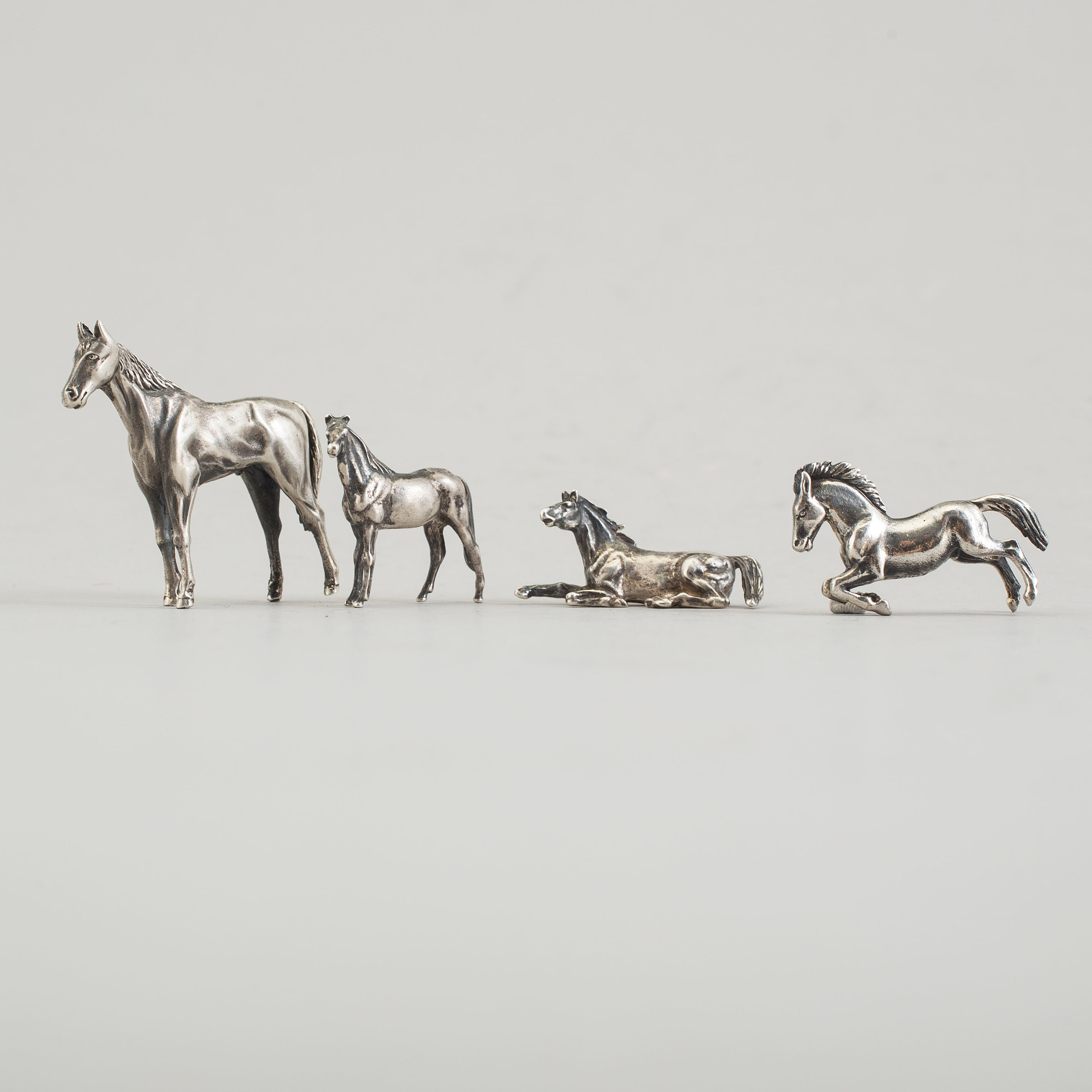 Four 20th century sterling silver miniature figures, partly from Sweden ...
