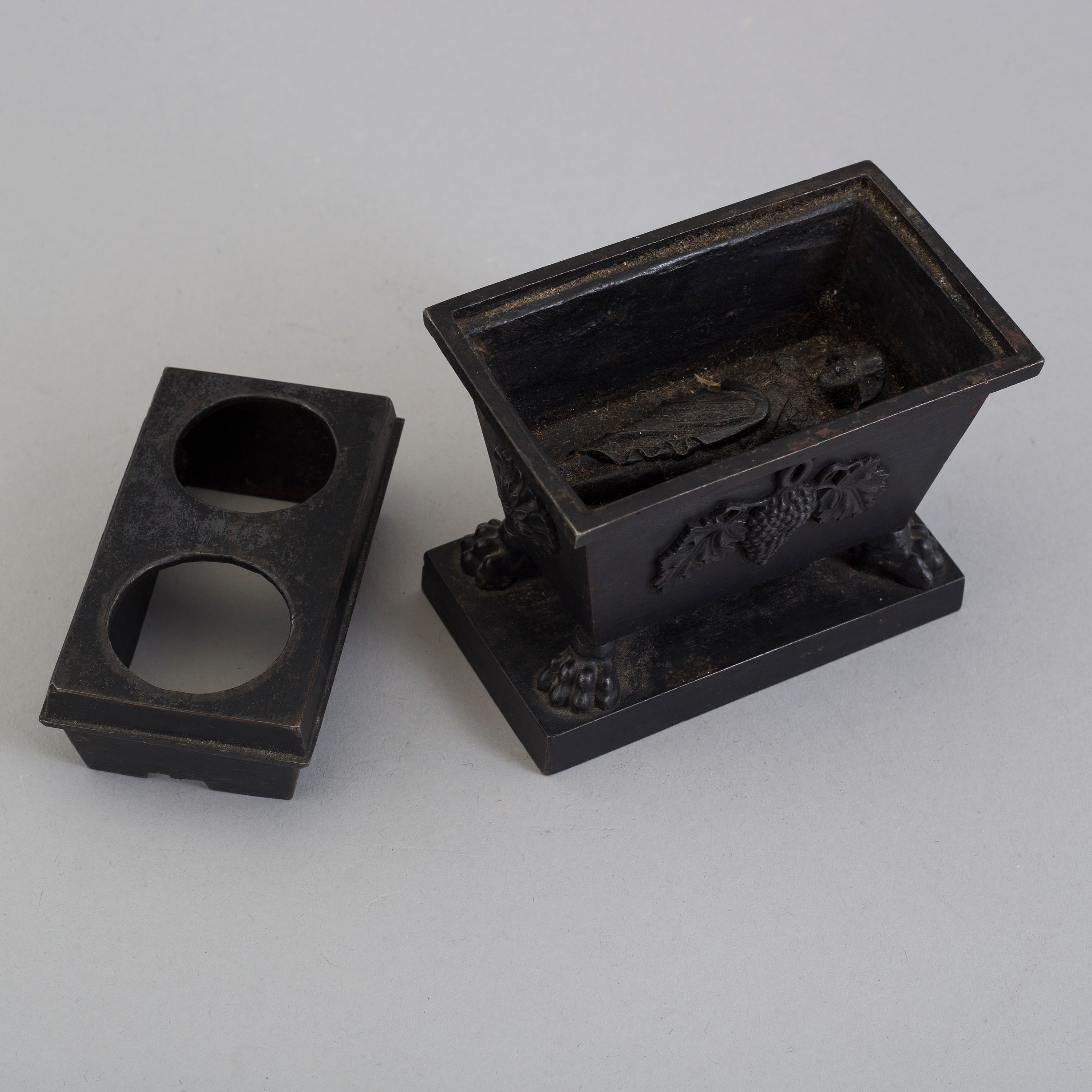 An Empire cast iron ink well in the shape of Napoleon's sarcophagus ...
