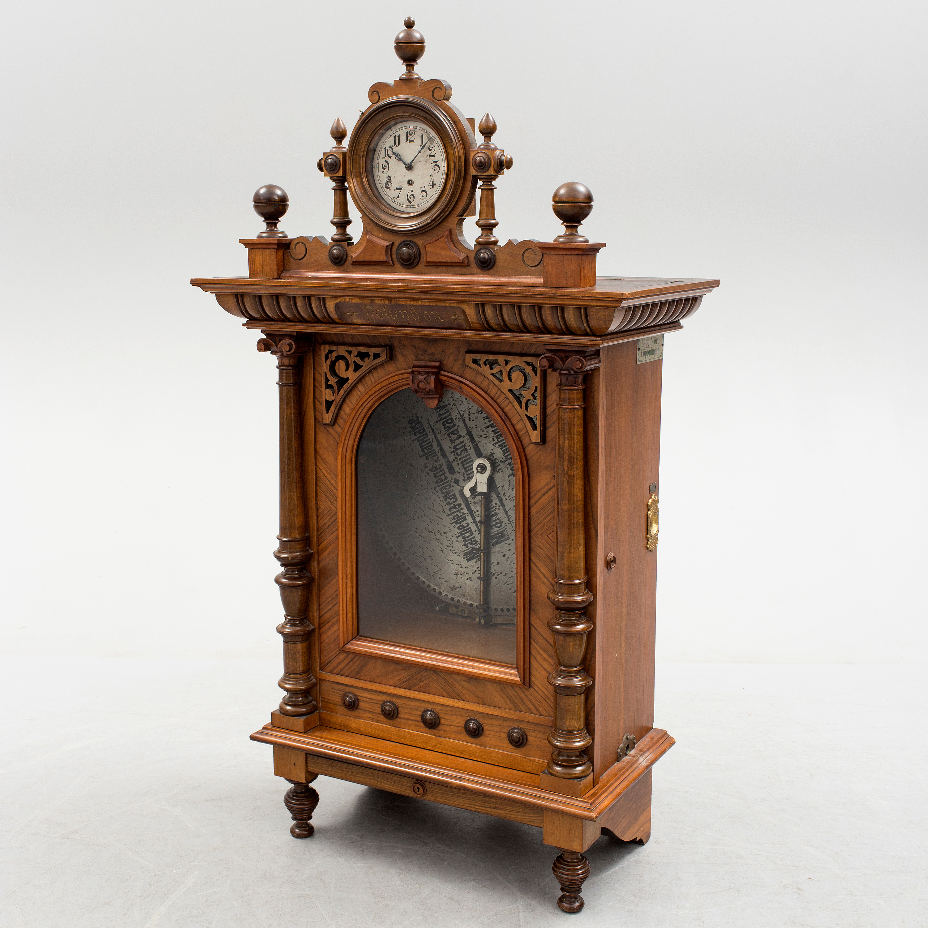 Polyphone with clock in walnut case, late 19th Century. - Bukowskis