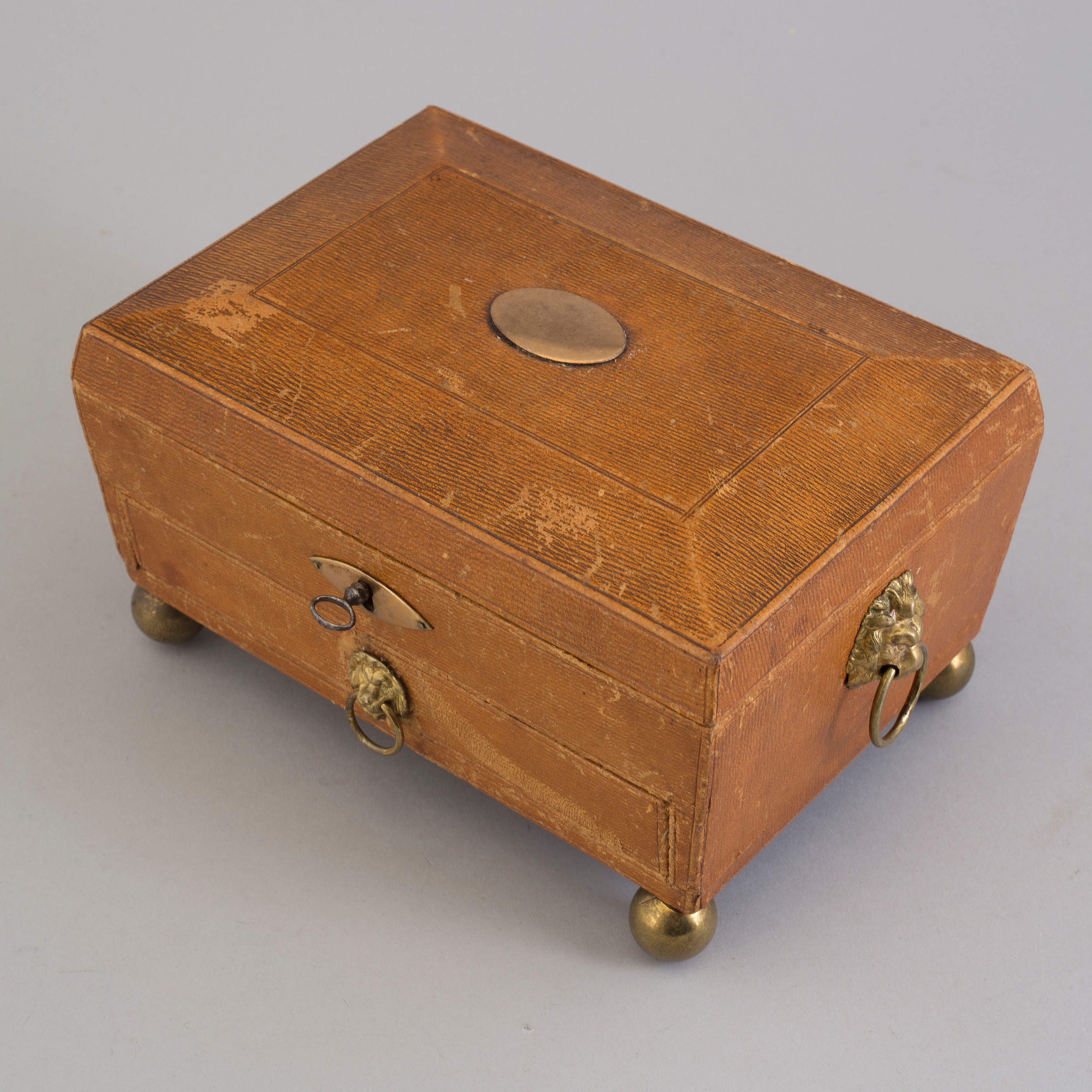 An early 19th century sewing box in the shape of a sarcophagus with ...