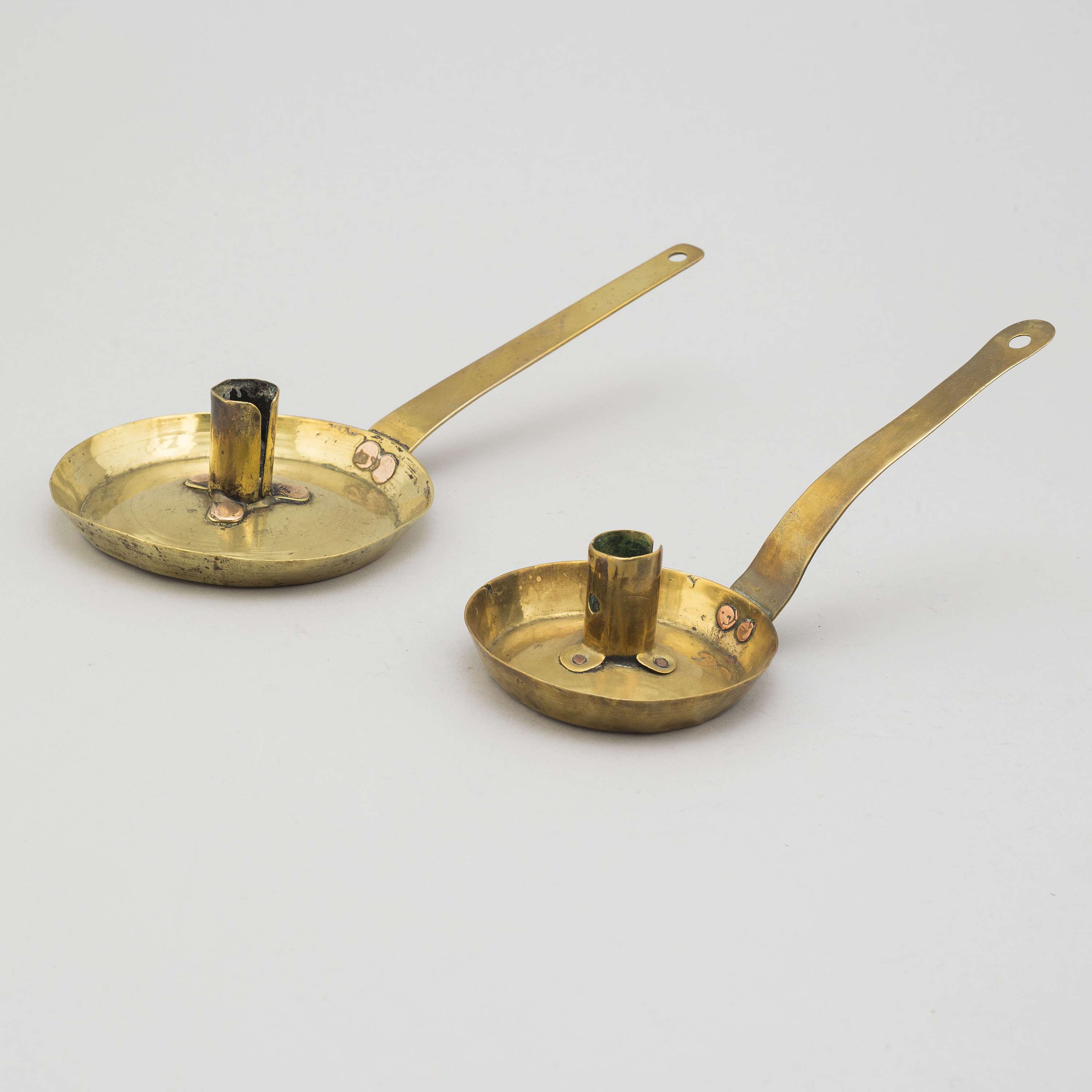 Two brass candlesticks, 18th century. - Bukowskis