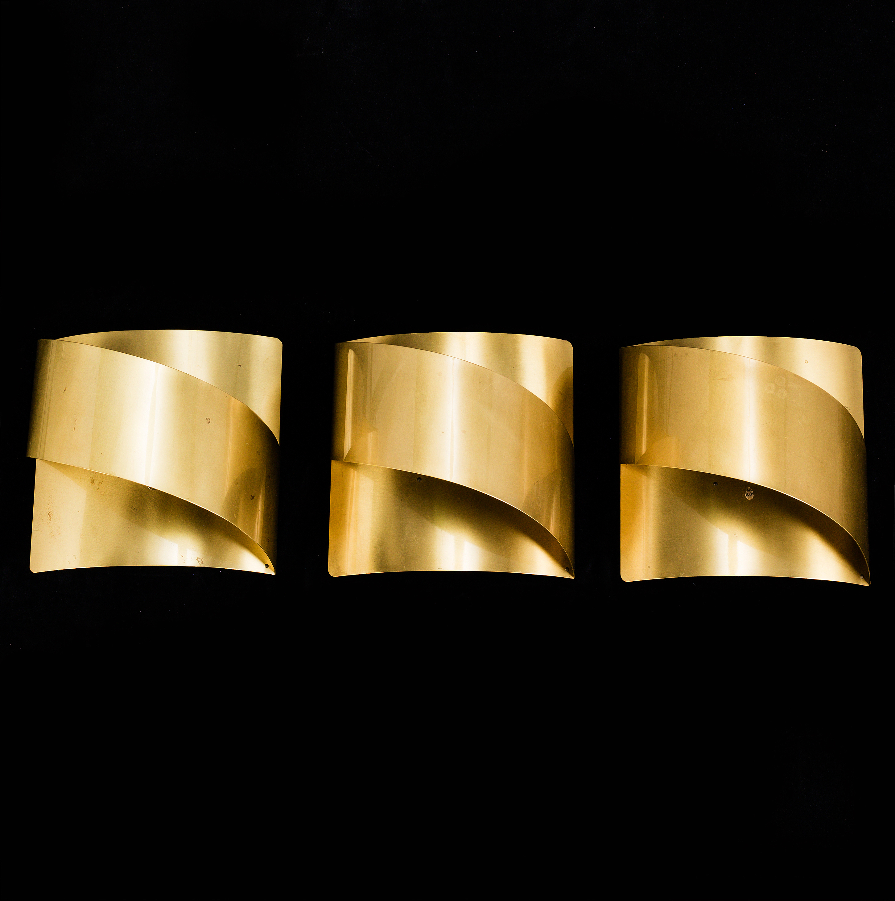 PETER CELSING, three 'Band' brass wall lights from Fagerhults and ...