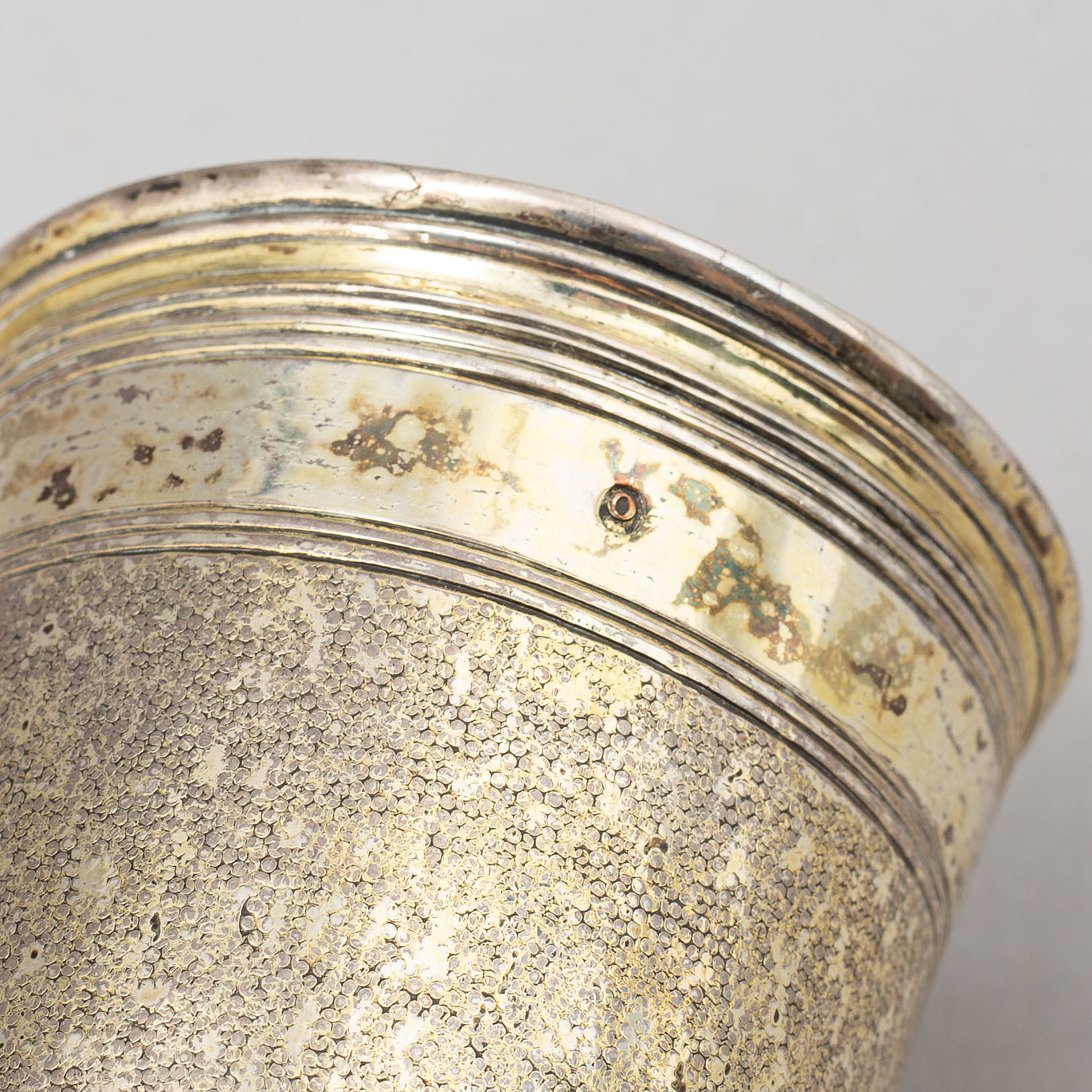 A German 17th century parcel-gilt silver beaker, unmarked. With later ...