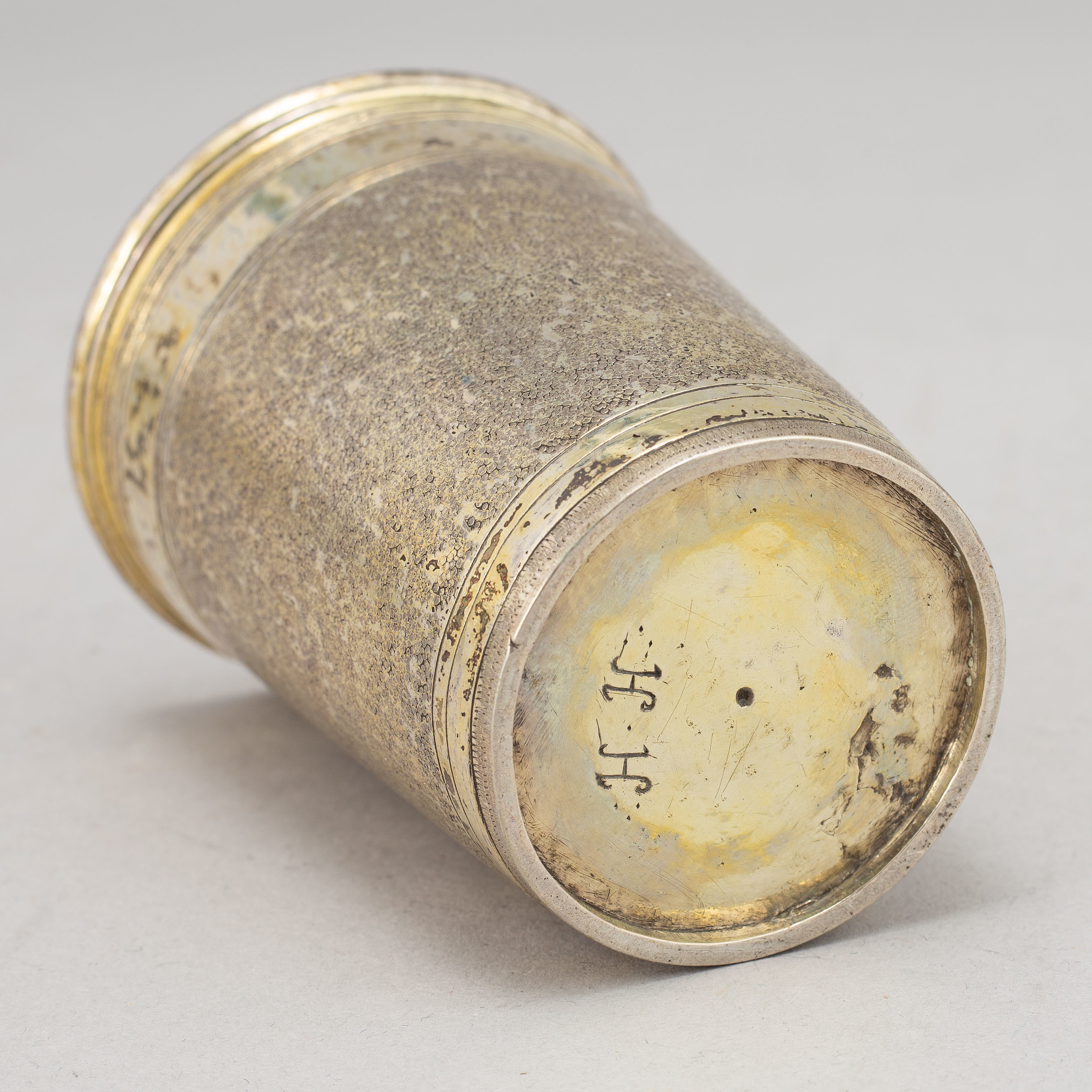 A German 17th century parcel-gilt silver beaker, unmarked. With later ...