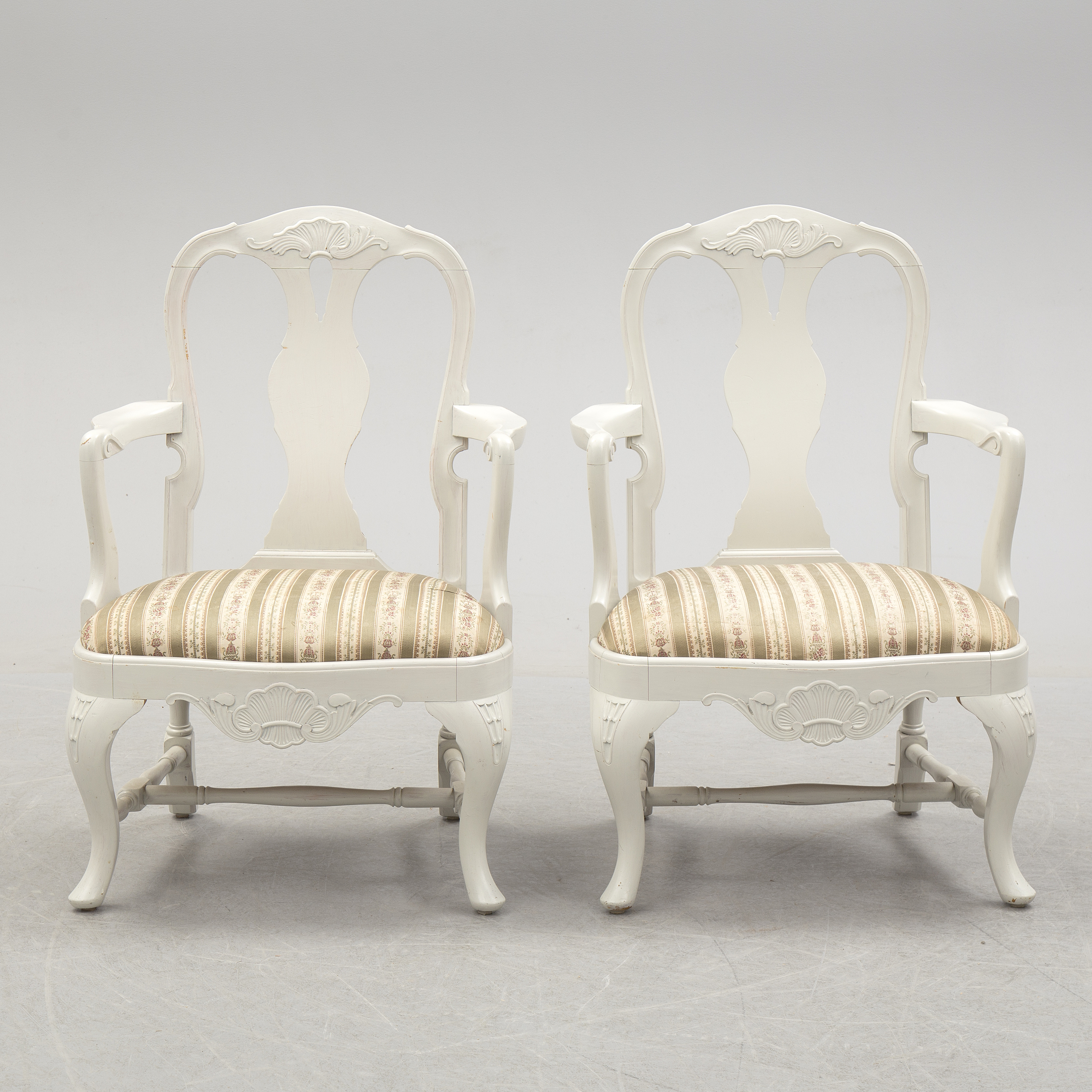 A pair of rococo style armchairs, first half of the 20th century ...