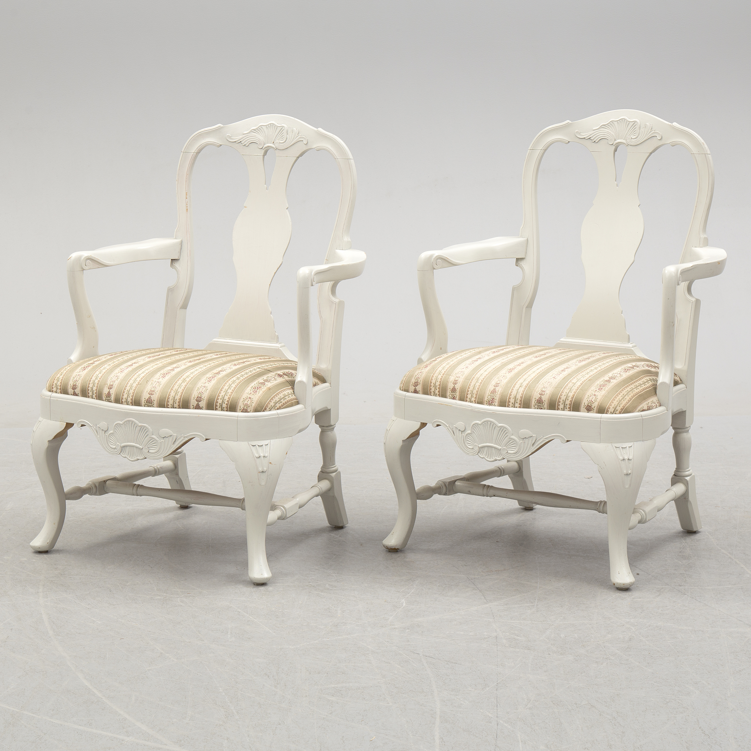 A pair of rococo style armchairs, first half of the 20th century ...