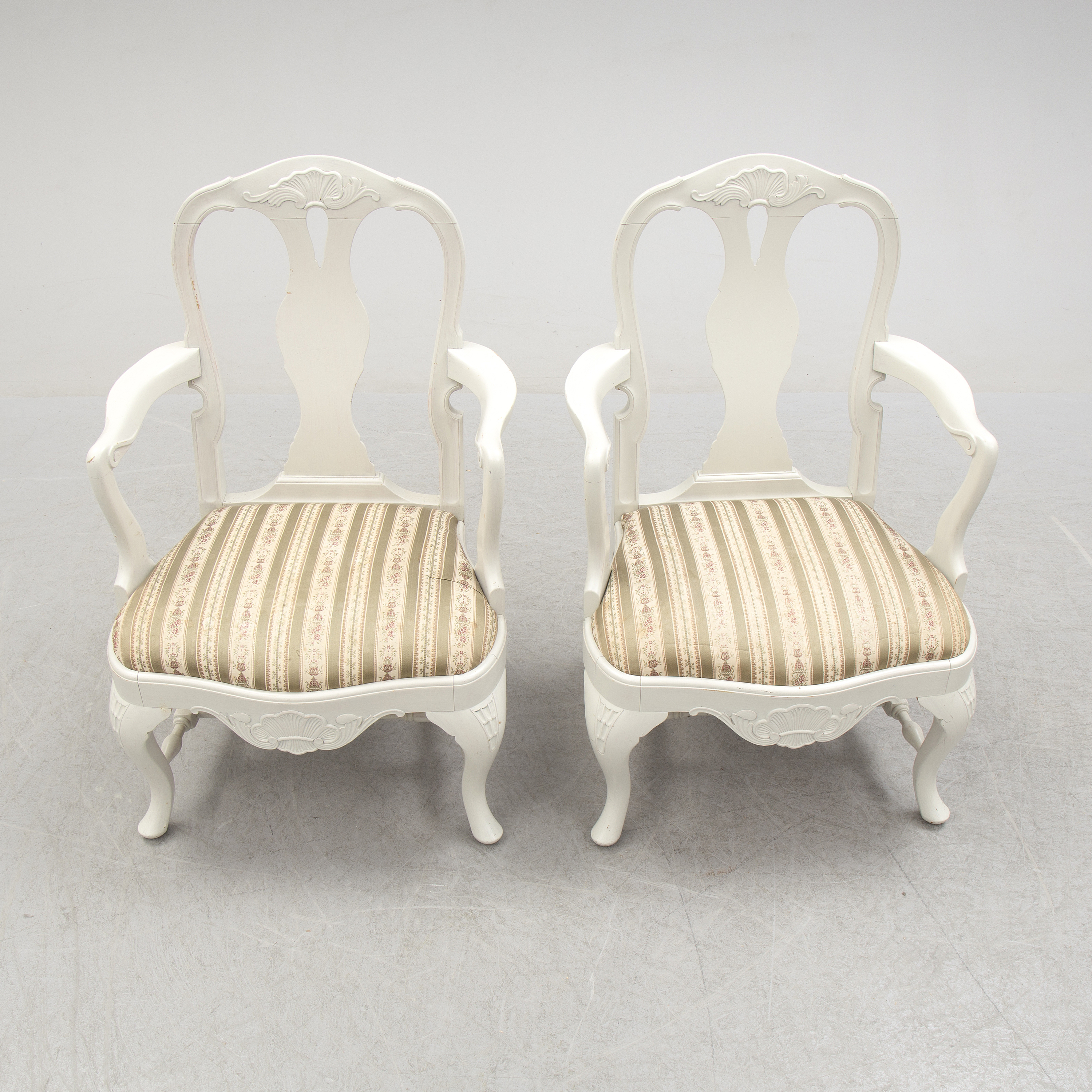 A pair of rococo style armchairs, first half of the 20th century ...