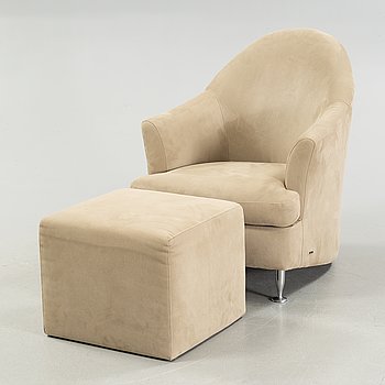 A lounge chair and a footstool from Natuzzi, Italy, 21th century ...
