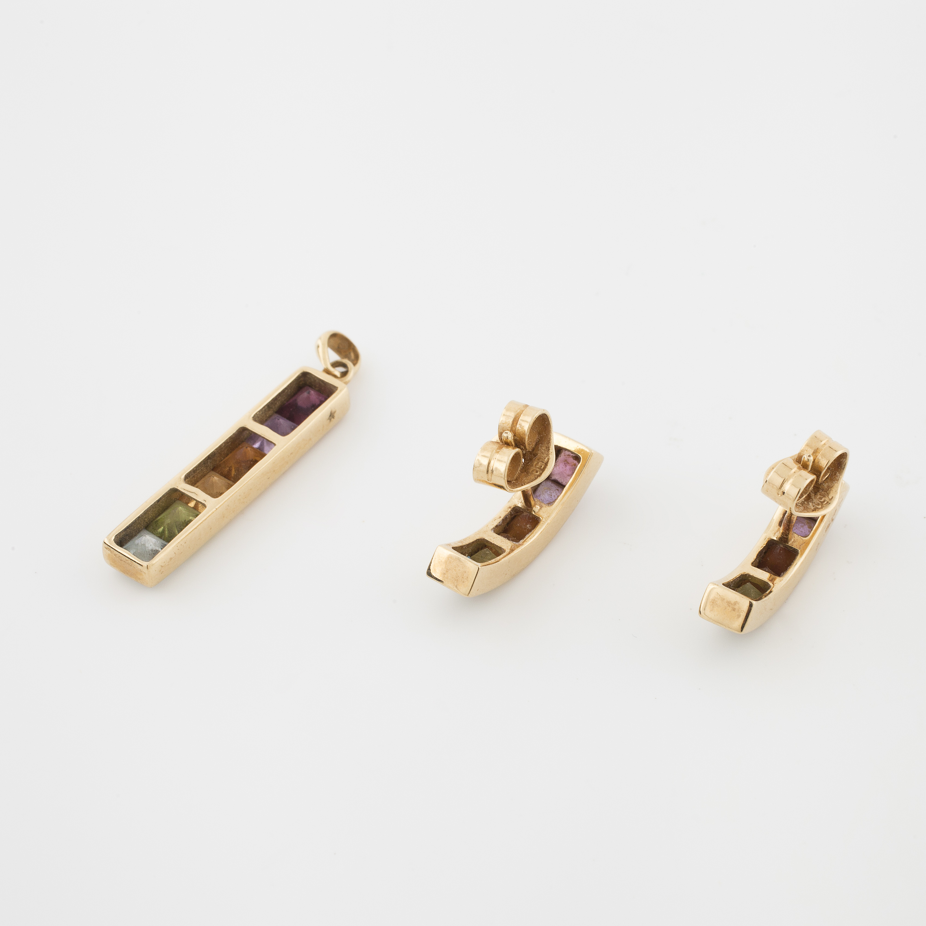 A multicolored gemstone pendant and a pair of earrings, "Collection ...