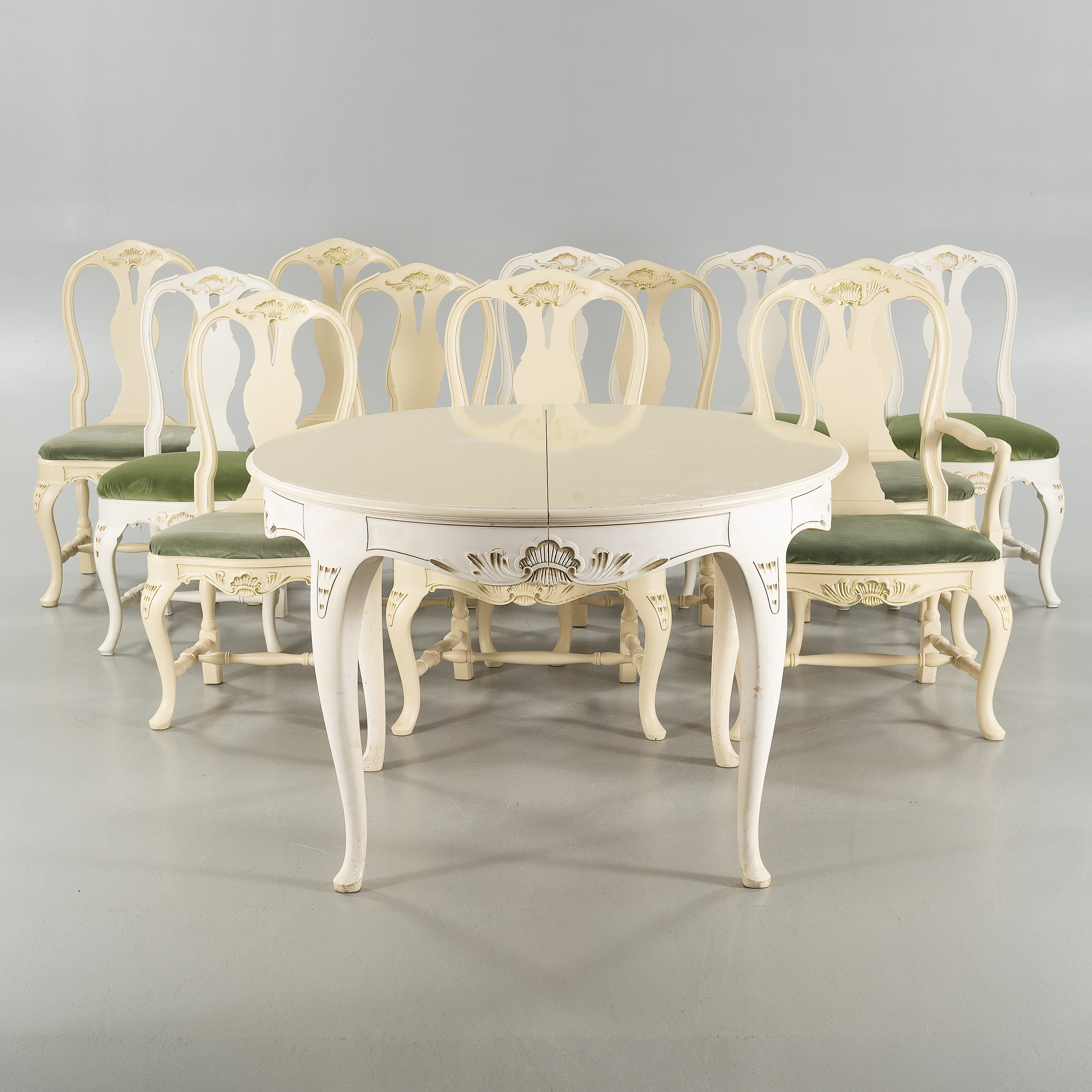 A rococo style table and twelve similar chairs, around the mid 20th ...