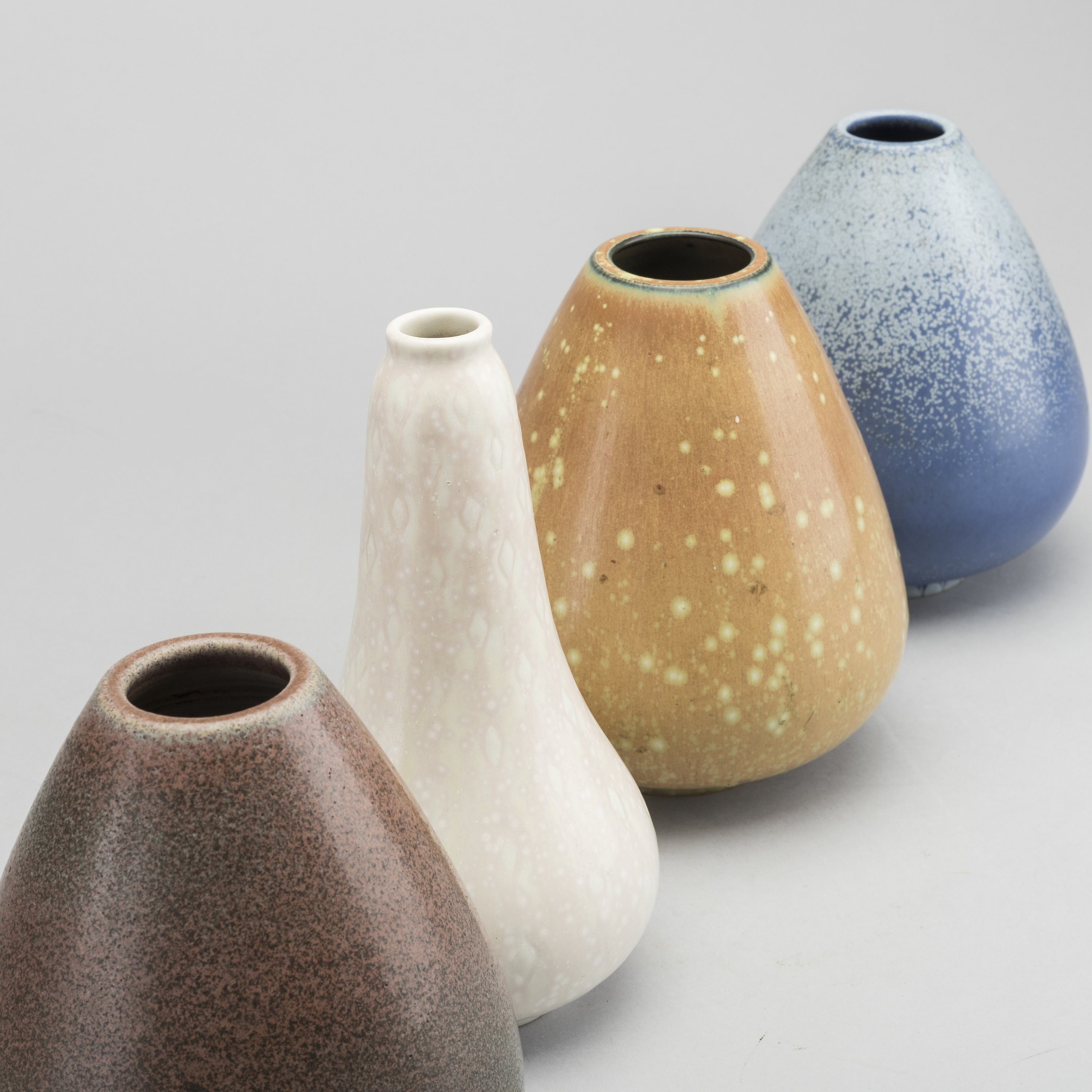 GUNNAR NYLUND, 4 stoneware vases, Rörstrand. - Bukowskis
