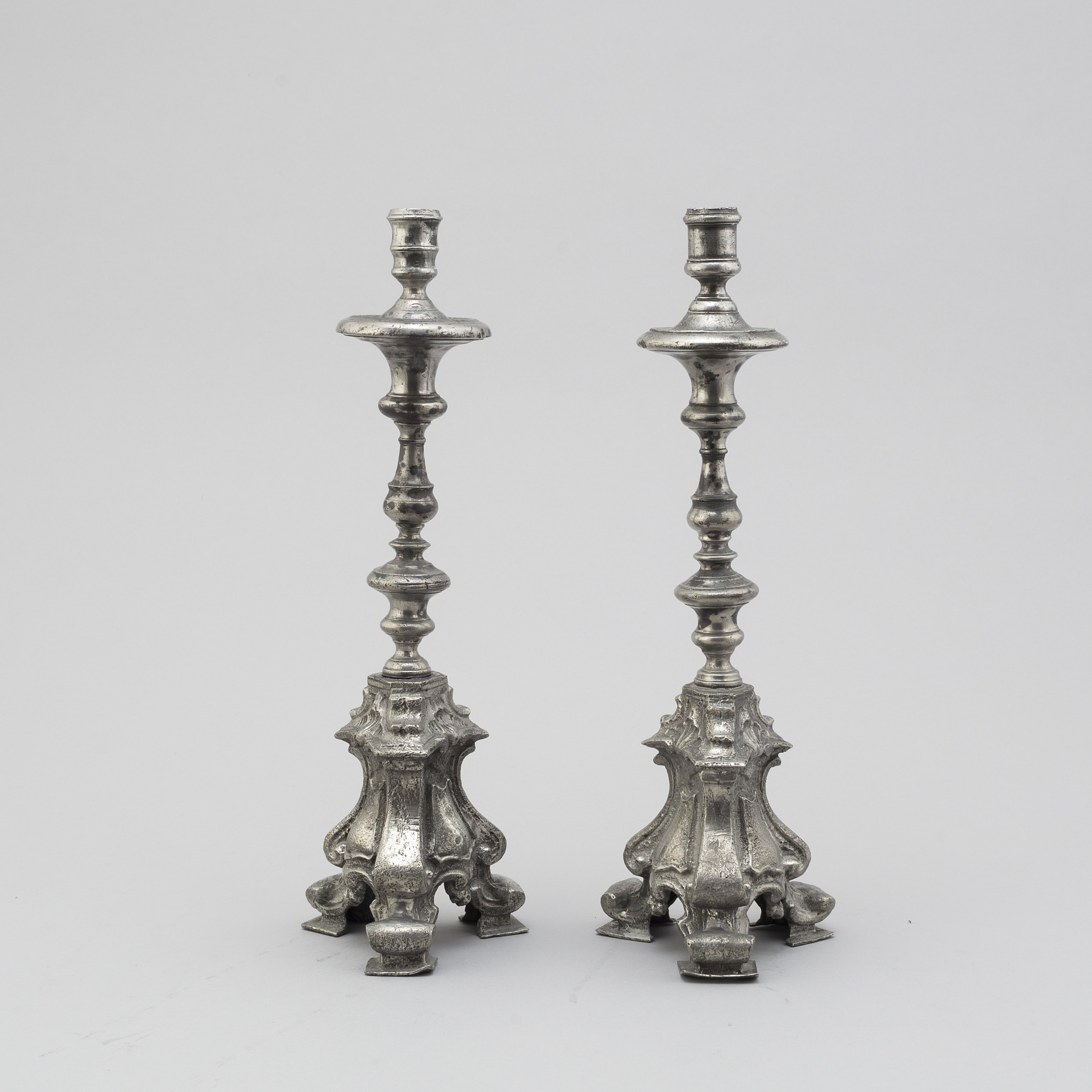 A pair of 19th century Baroque style candlesticks. - Bukowskis