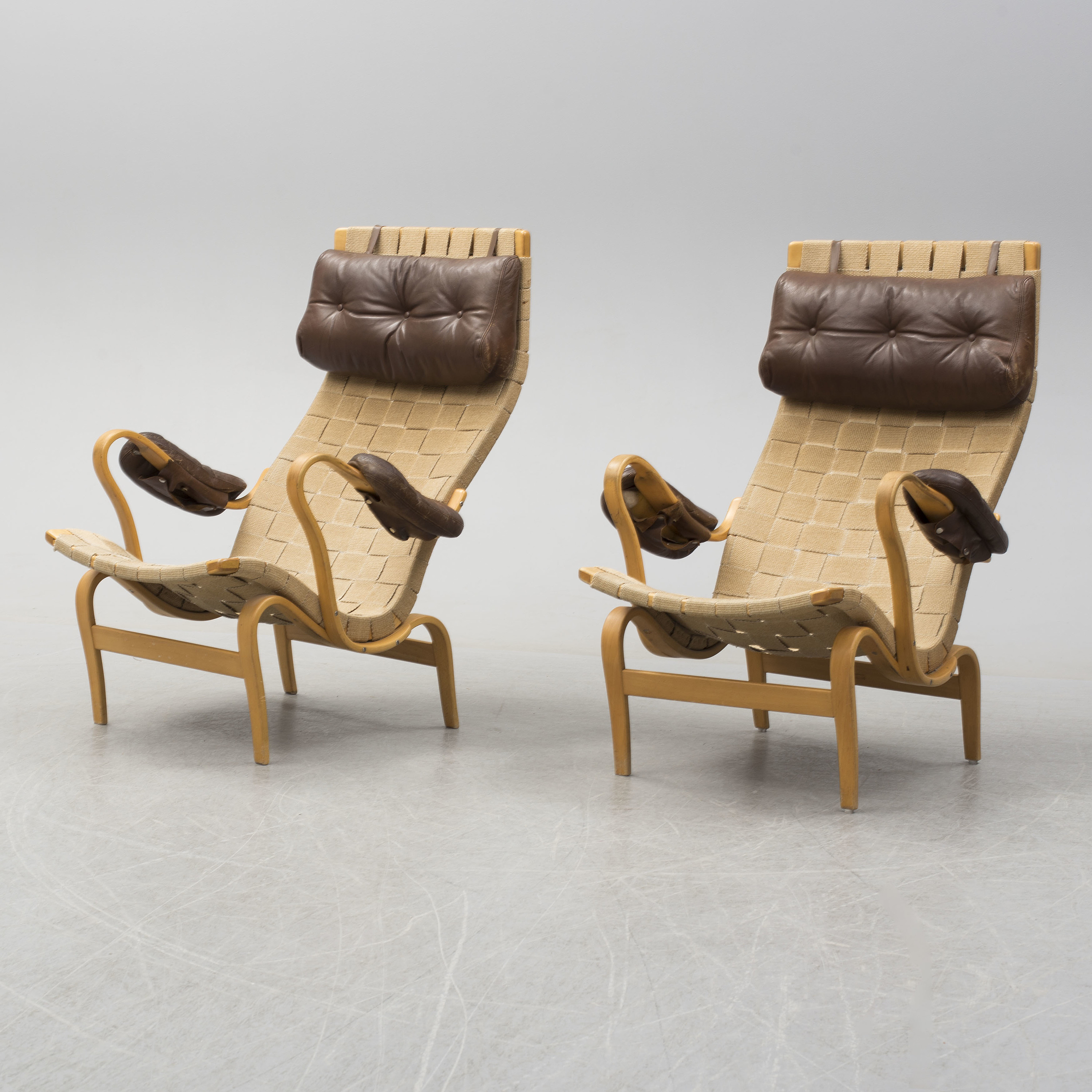 A pair of 'Pernilla' easy chairs by Bruno Mathsson, 1977. - Bukowskis
