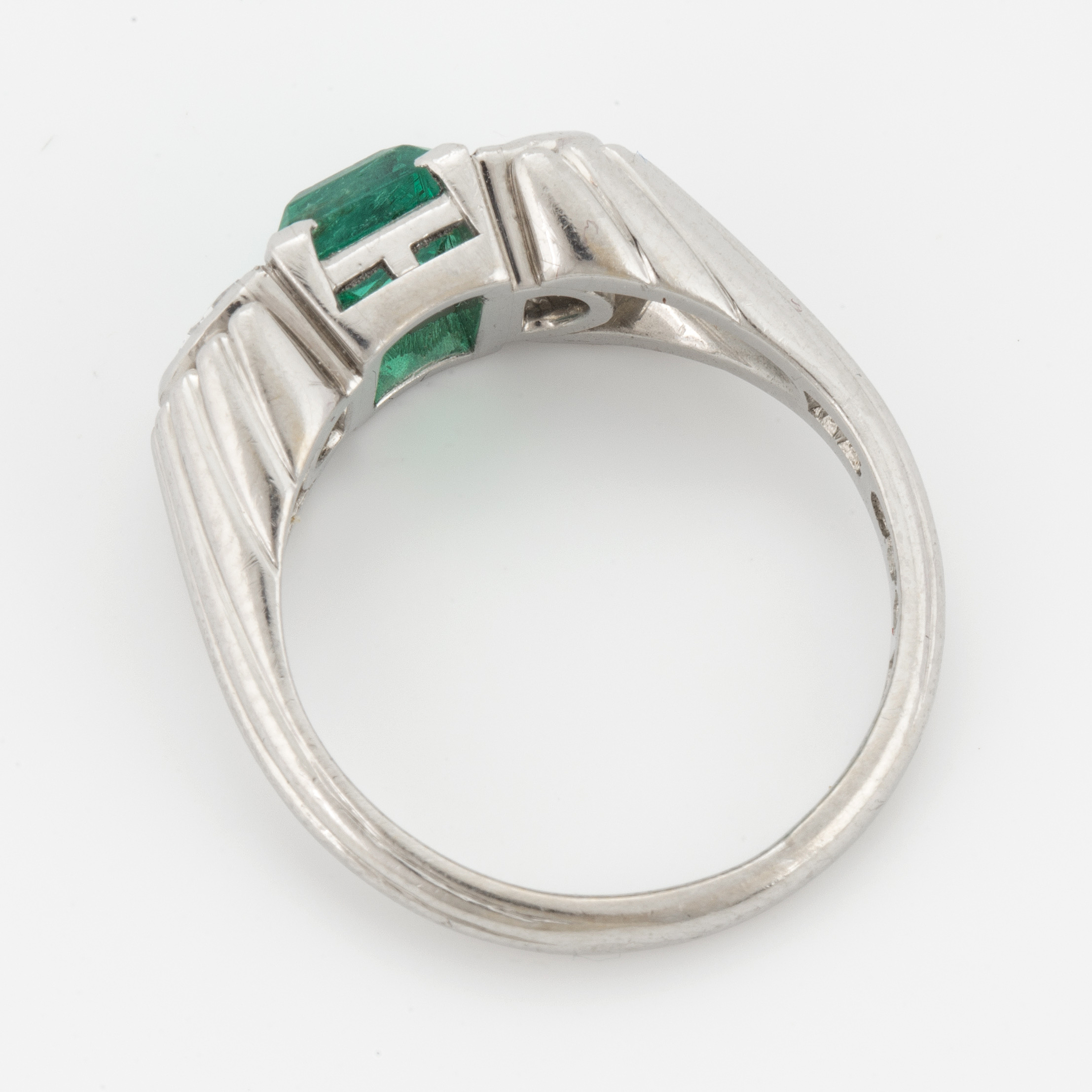 A WA Bolin platinum ring set with a faceted emerald ca 0.90 cts ...