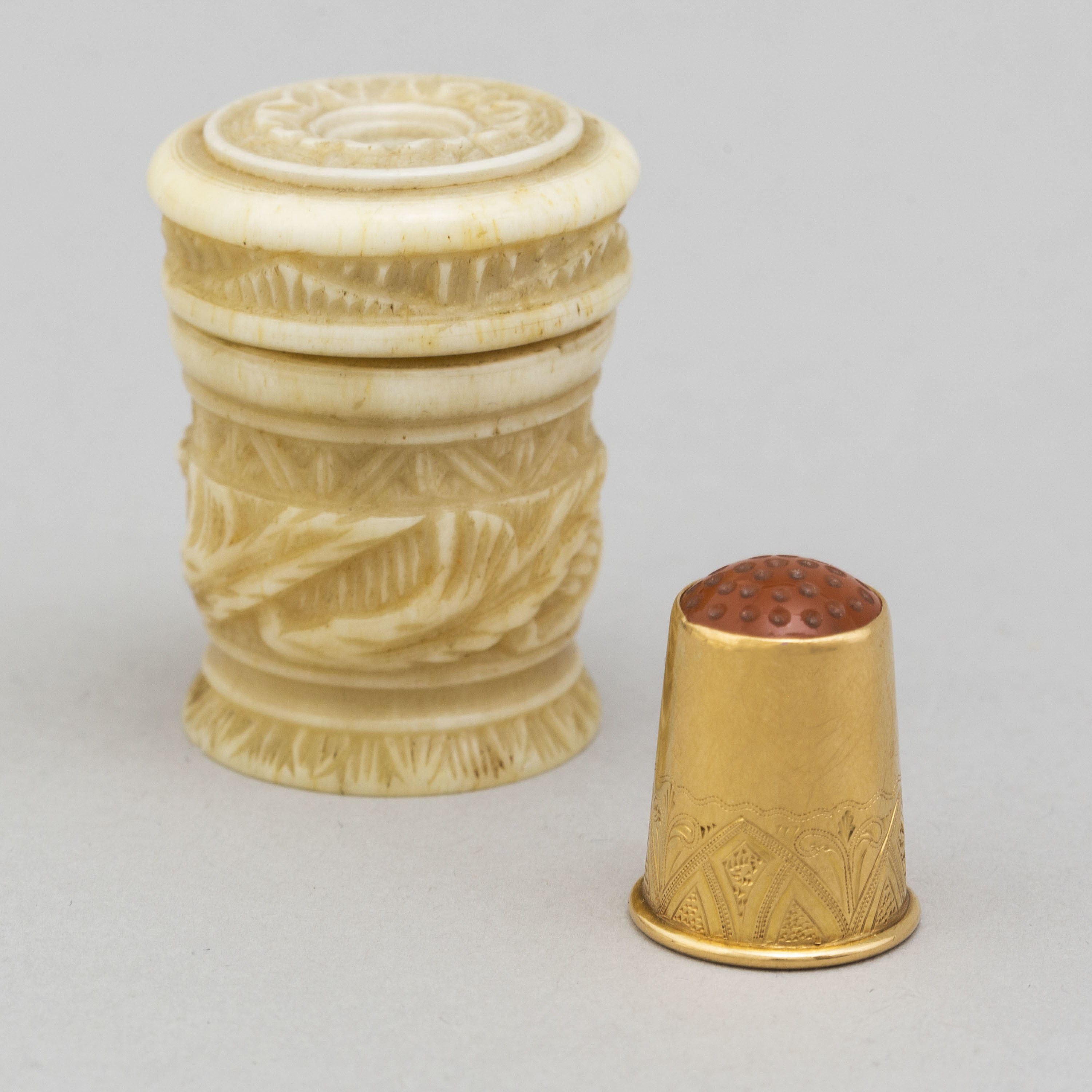 A Swedish 19th century gold thimble set with carnelian, marked CGH ...