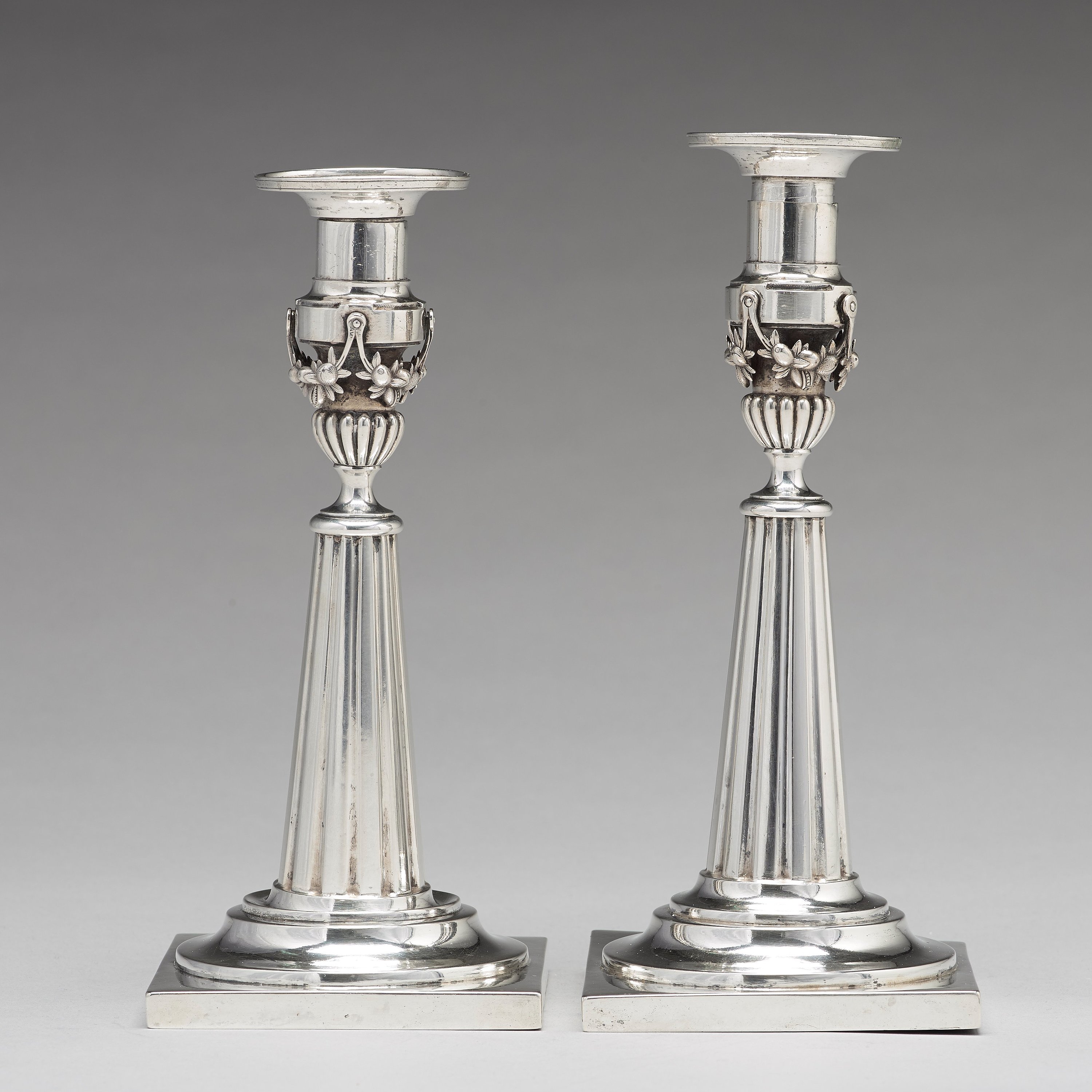A pair of German early 19th century silver candlesticks, mark of Johann ...