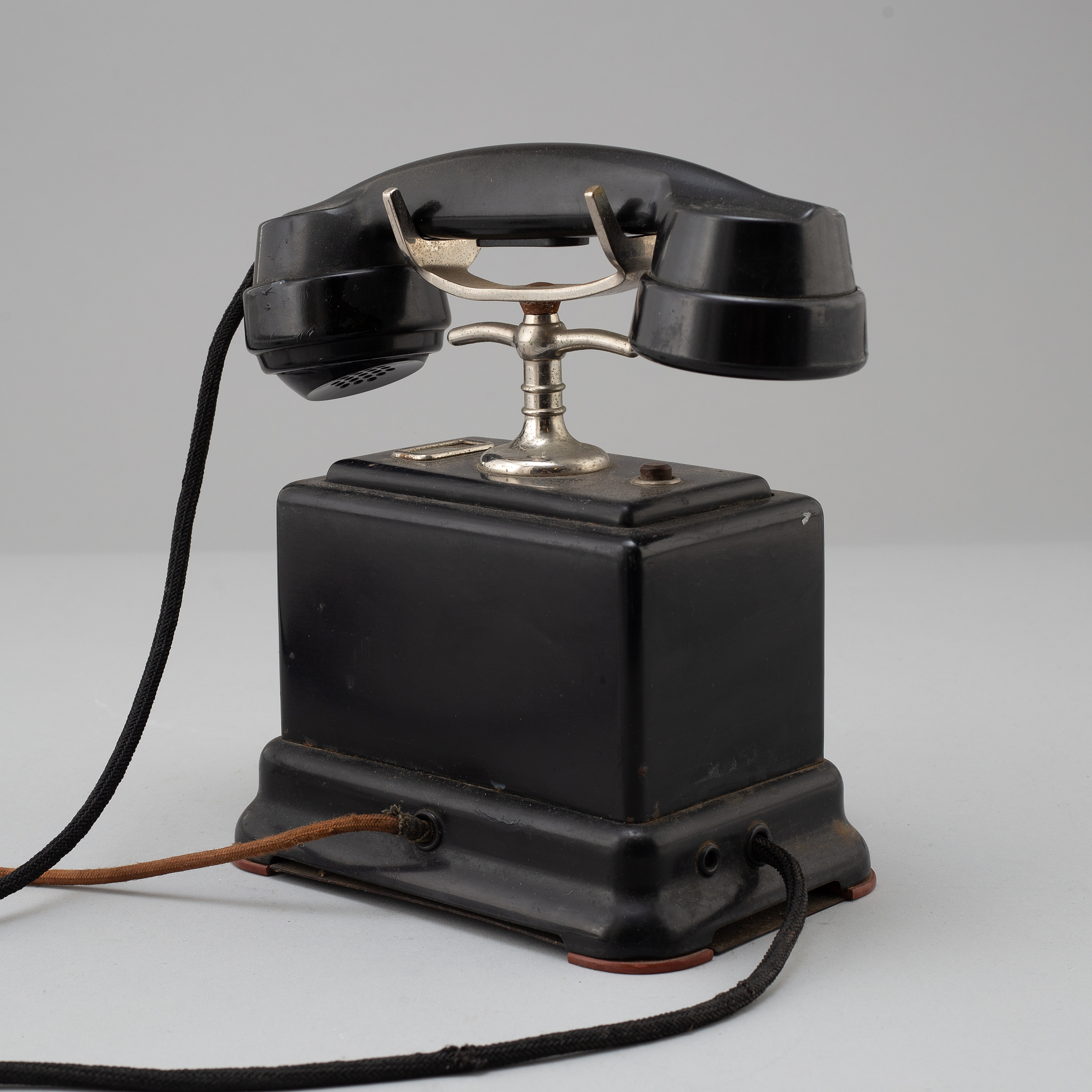 TWO BAKELITE TELEPHONES, one marked LM Ericsson, first half of the 20th ...