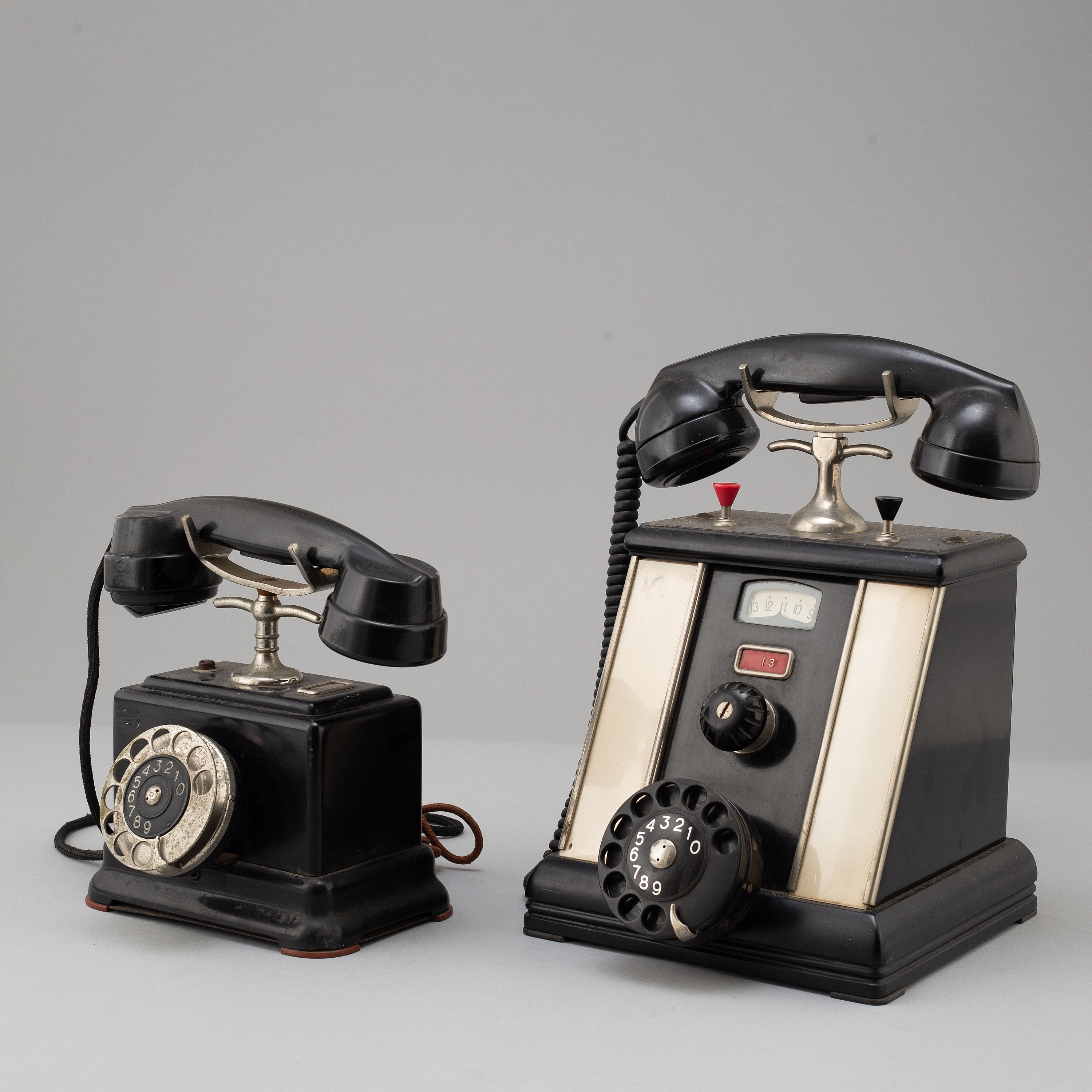 TWO BAKELITE TELEPHONES, one marked LM Ericsson, first half of the 20th ...