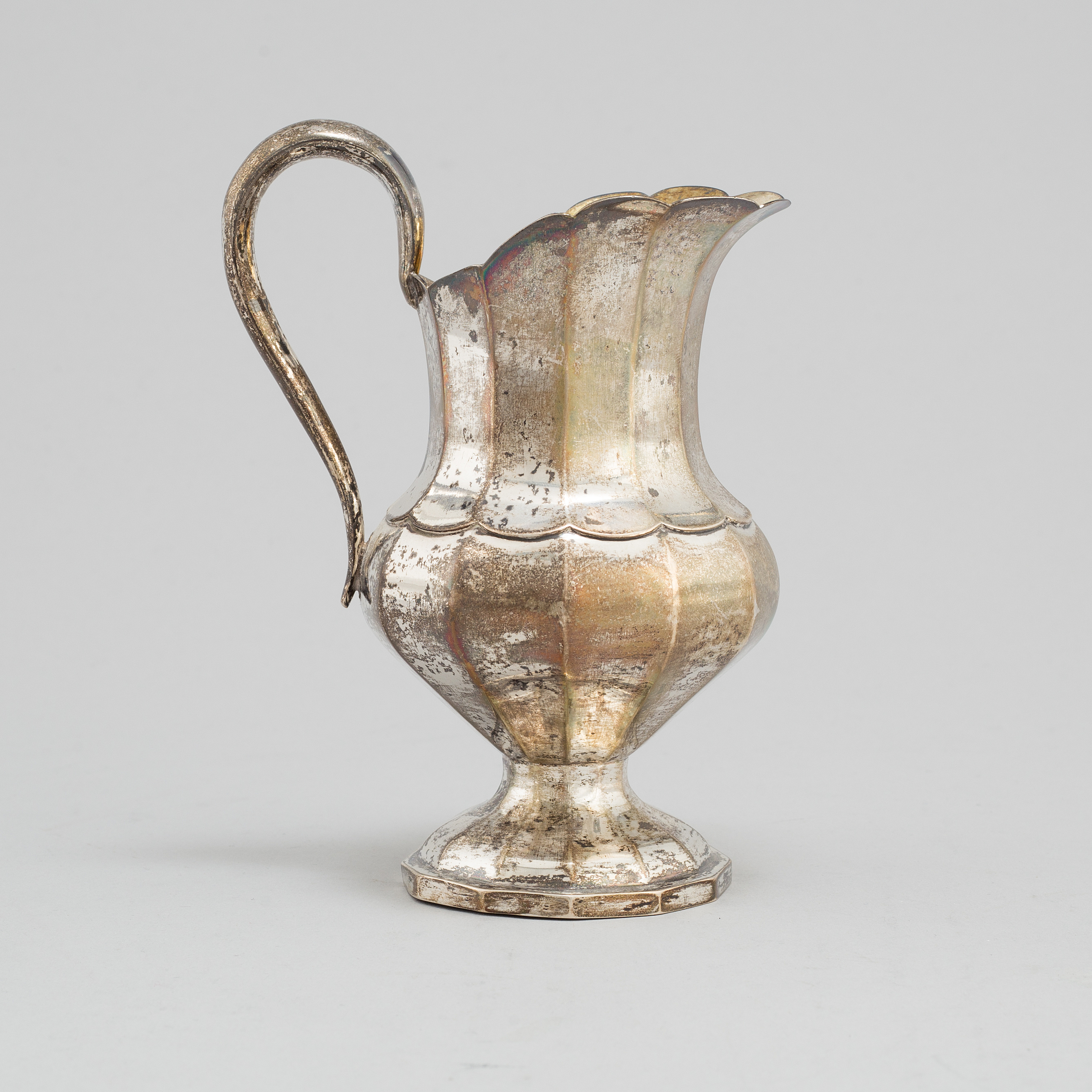 A Swedish 19th century parcel-gilt silver cream-jug, mark of Johan ...