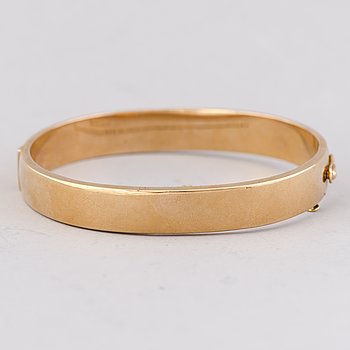 ARMRING, 14K guld. Helsingfors 1964. - Bukowskis