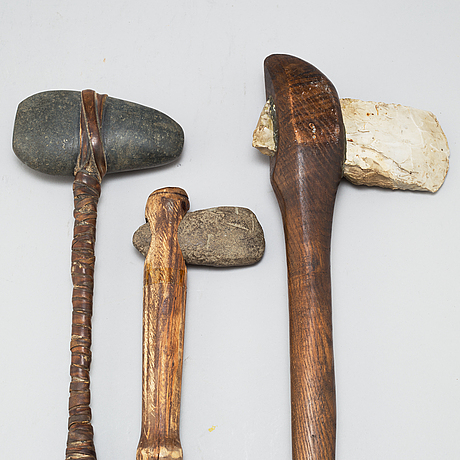 Three stone axes with modern handles. - Bukowskis