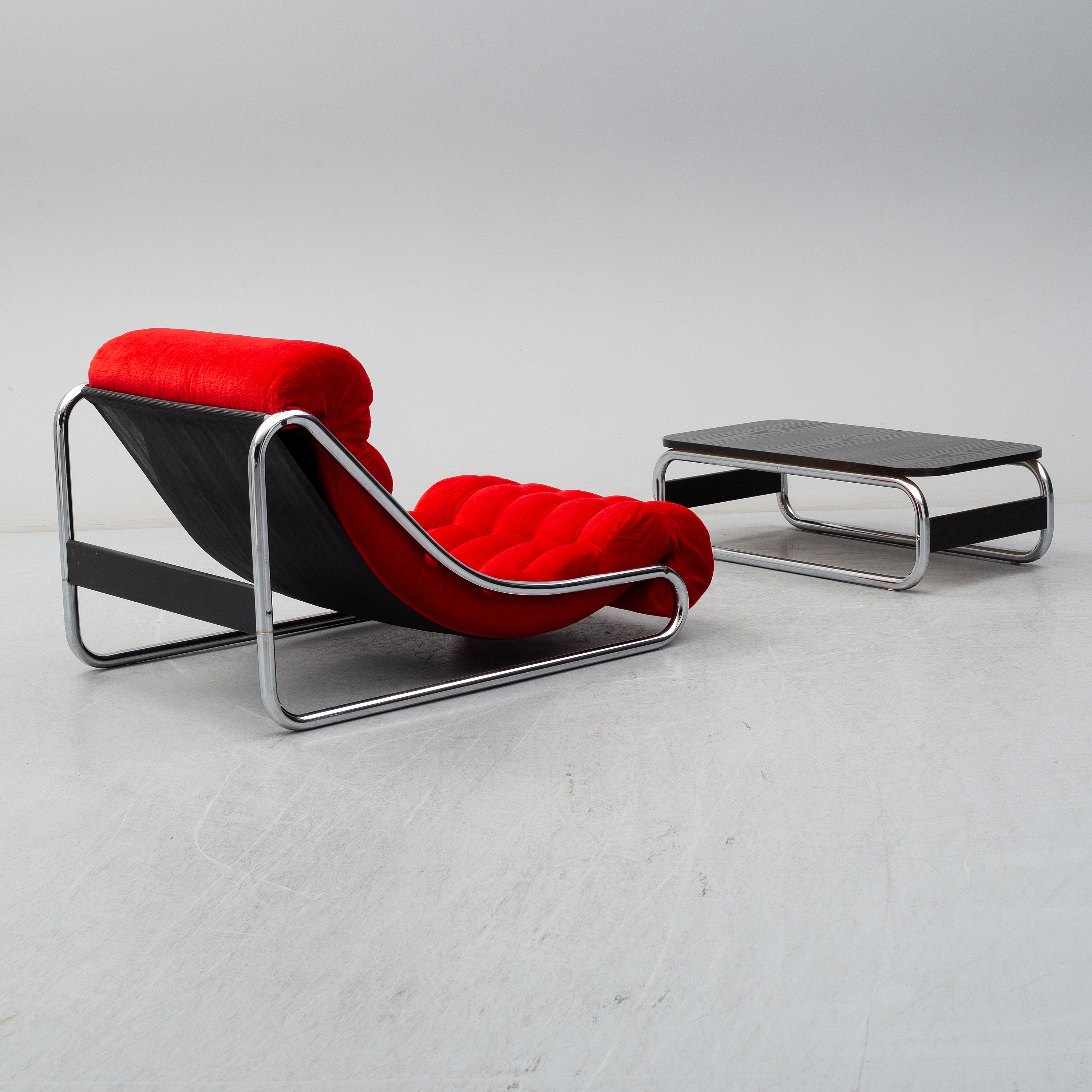 An 'Impala' easy chair with table by Gillis Lundgren, IKEA. - Bukowskis