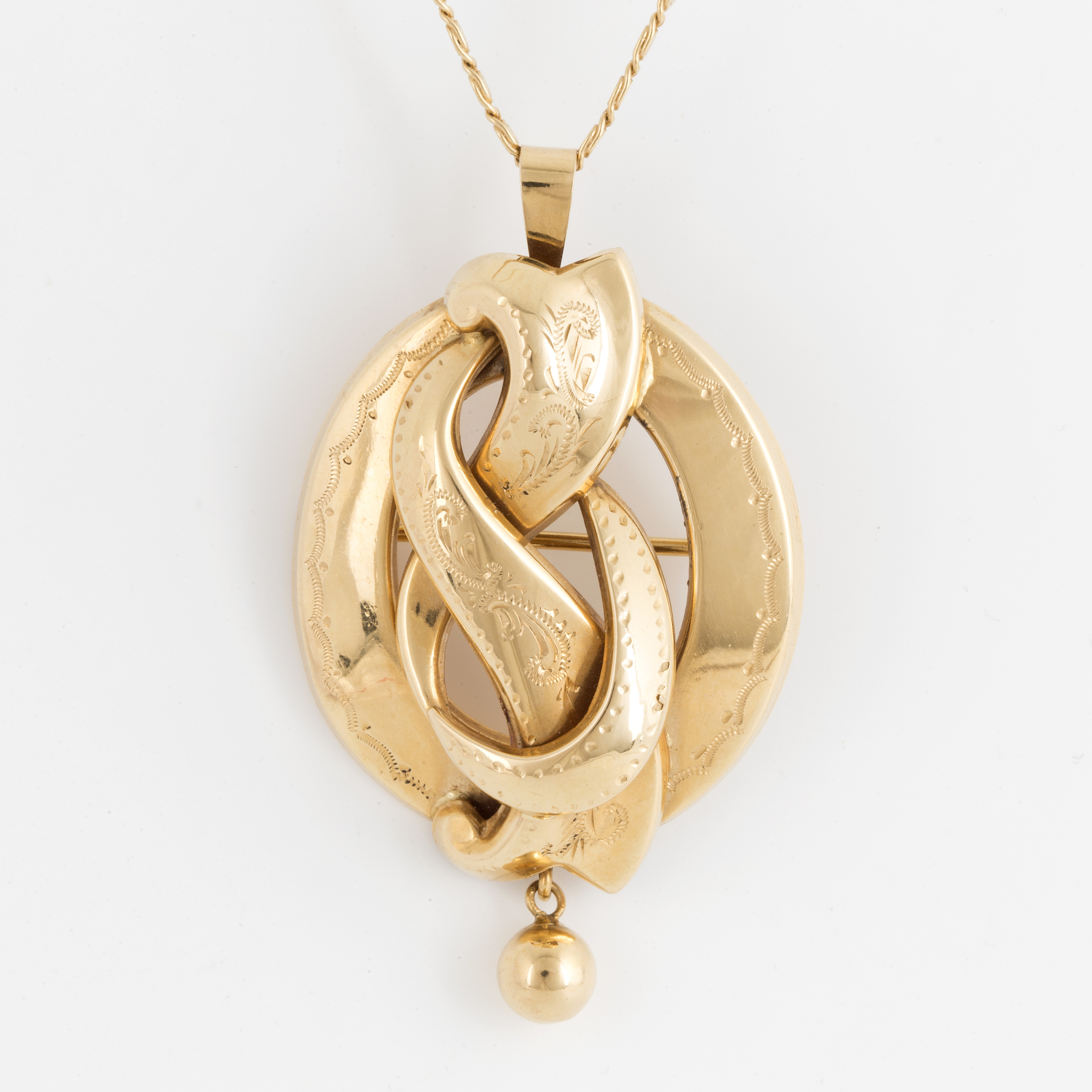 A brooch/pendant with chain, 18K gold. - Bukowskis