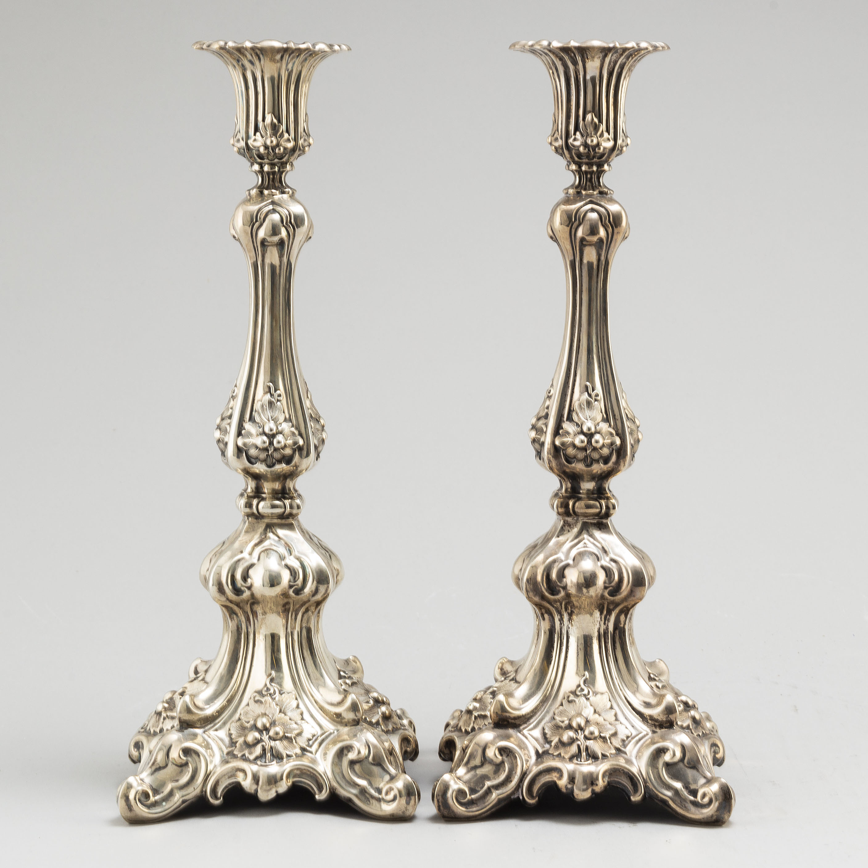 A pair of 800 silver baroque style candlesticks, Germany around 1900 ...