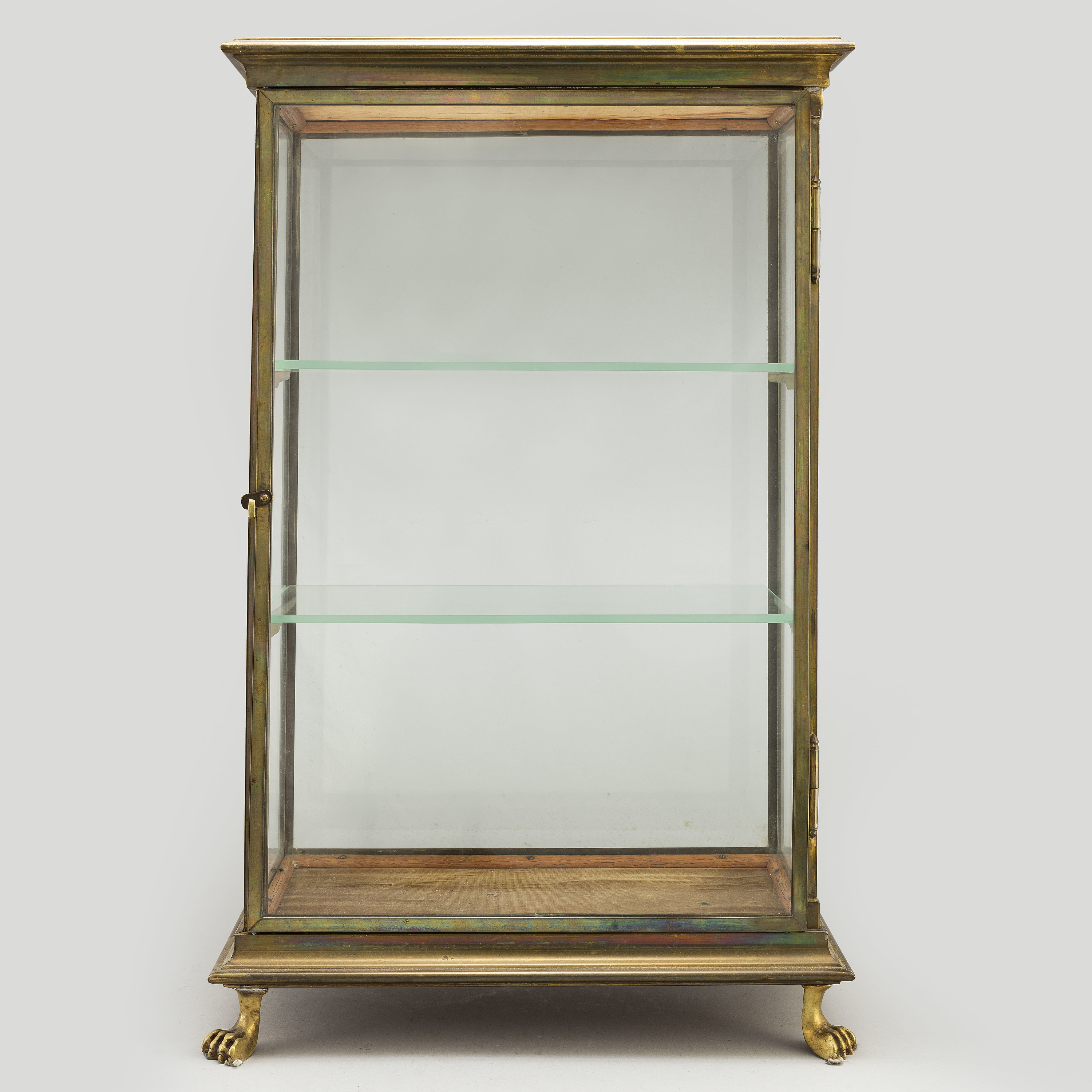 A brass and glass display cabinet, first half of the 20th Century ...