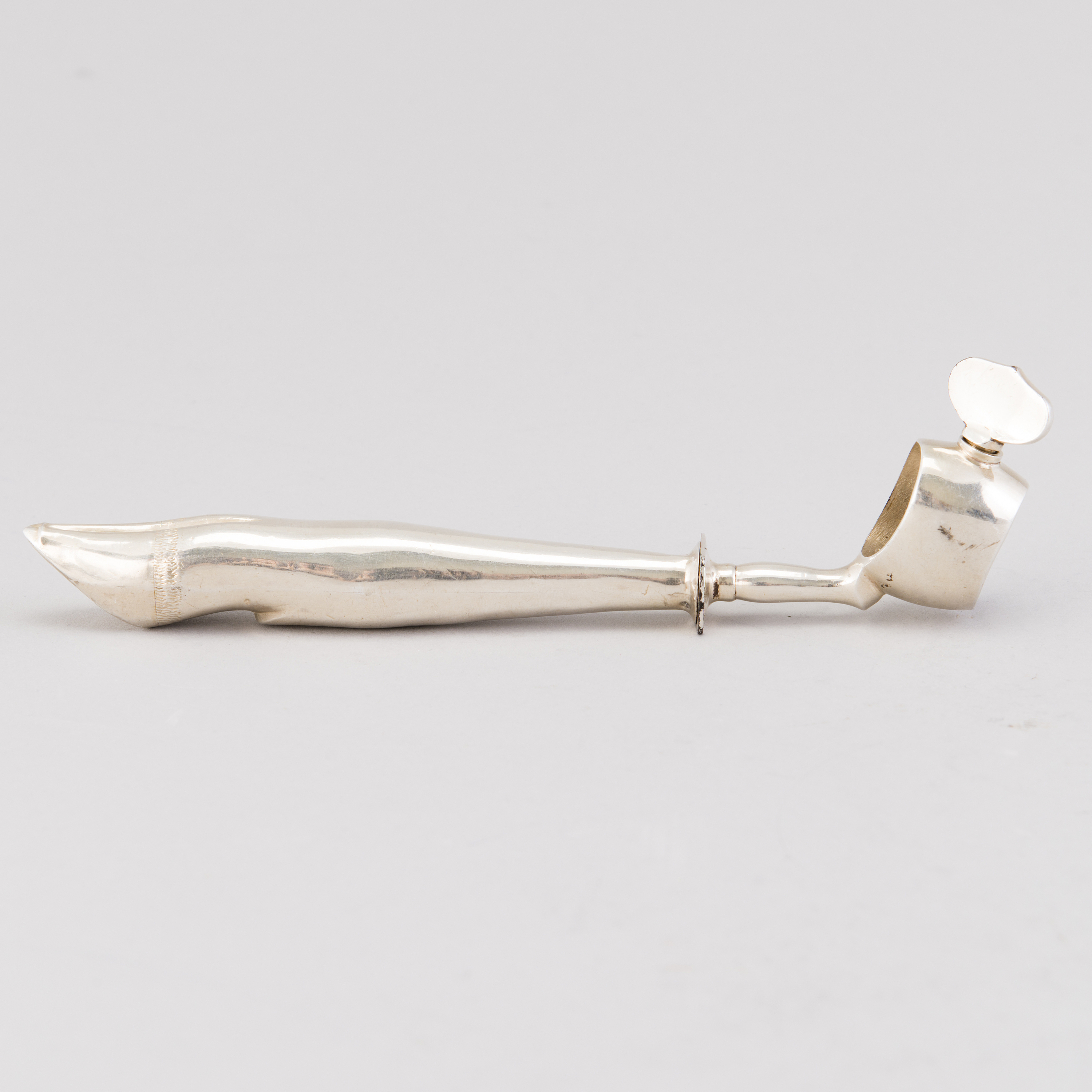 A French silver and silver plated lamb bone holder from the end of the ...