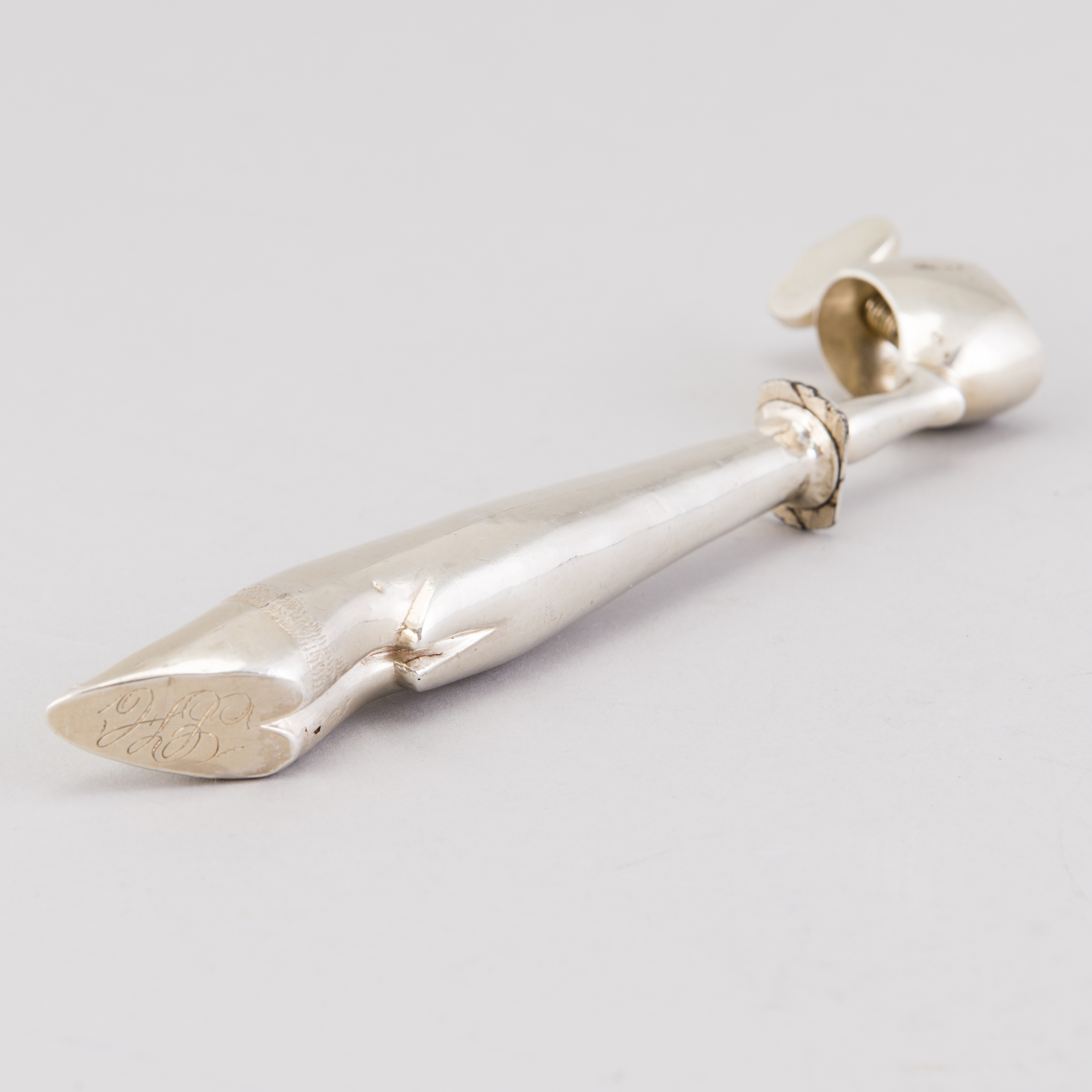 A French silver and silver plated lamb bone holder from the end of the ...