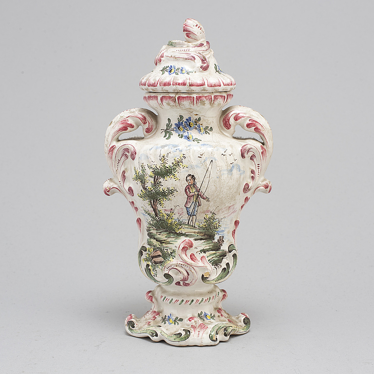 A Rococo faiance vase with cover, mid 18th century. - Bukowskis